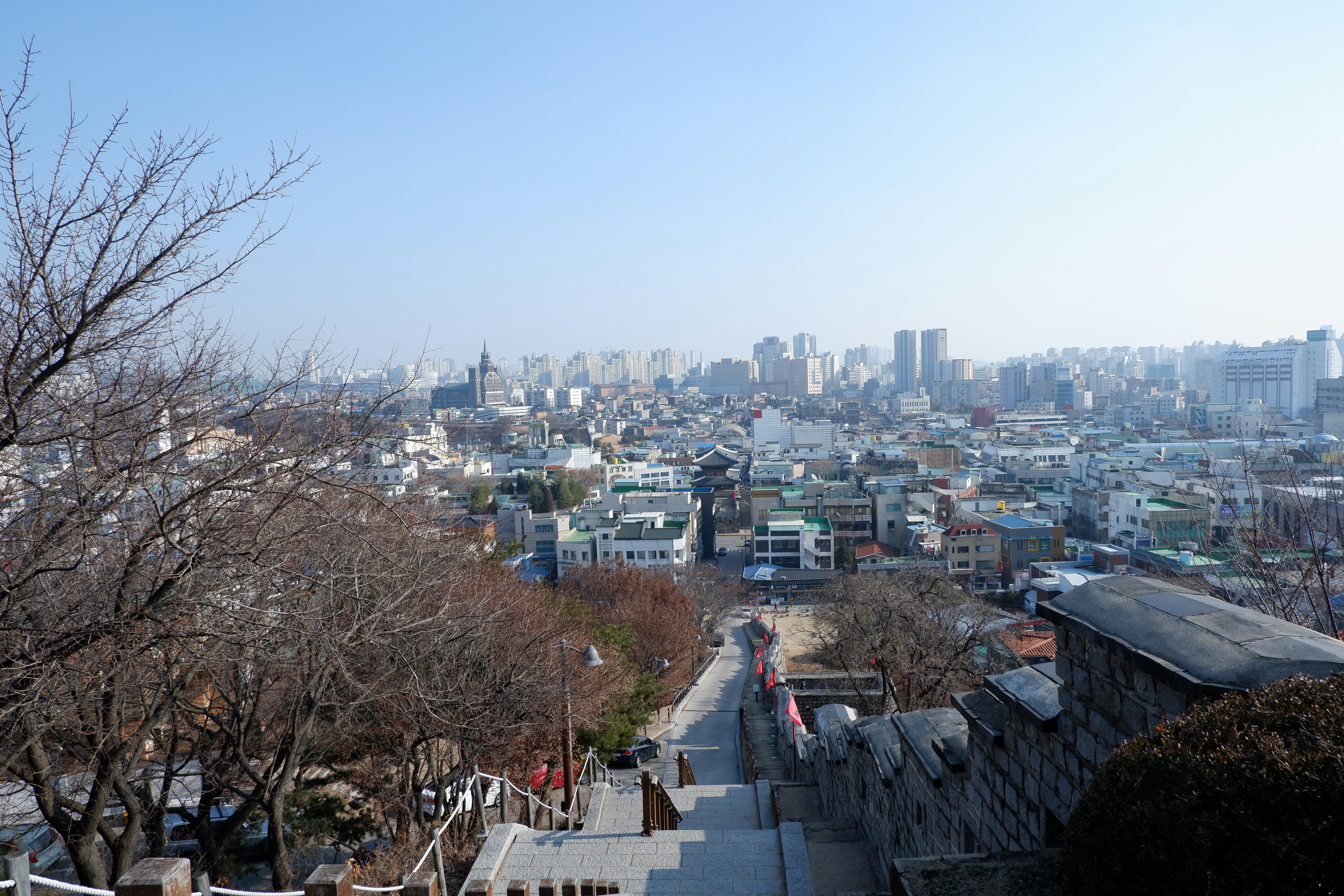 Cityscape from a Historic Terrace: Steps Toward the Distant Skyline