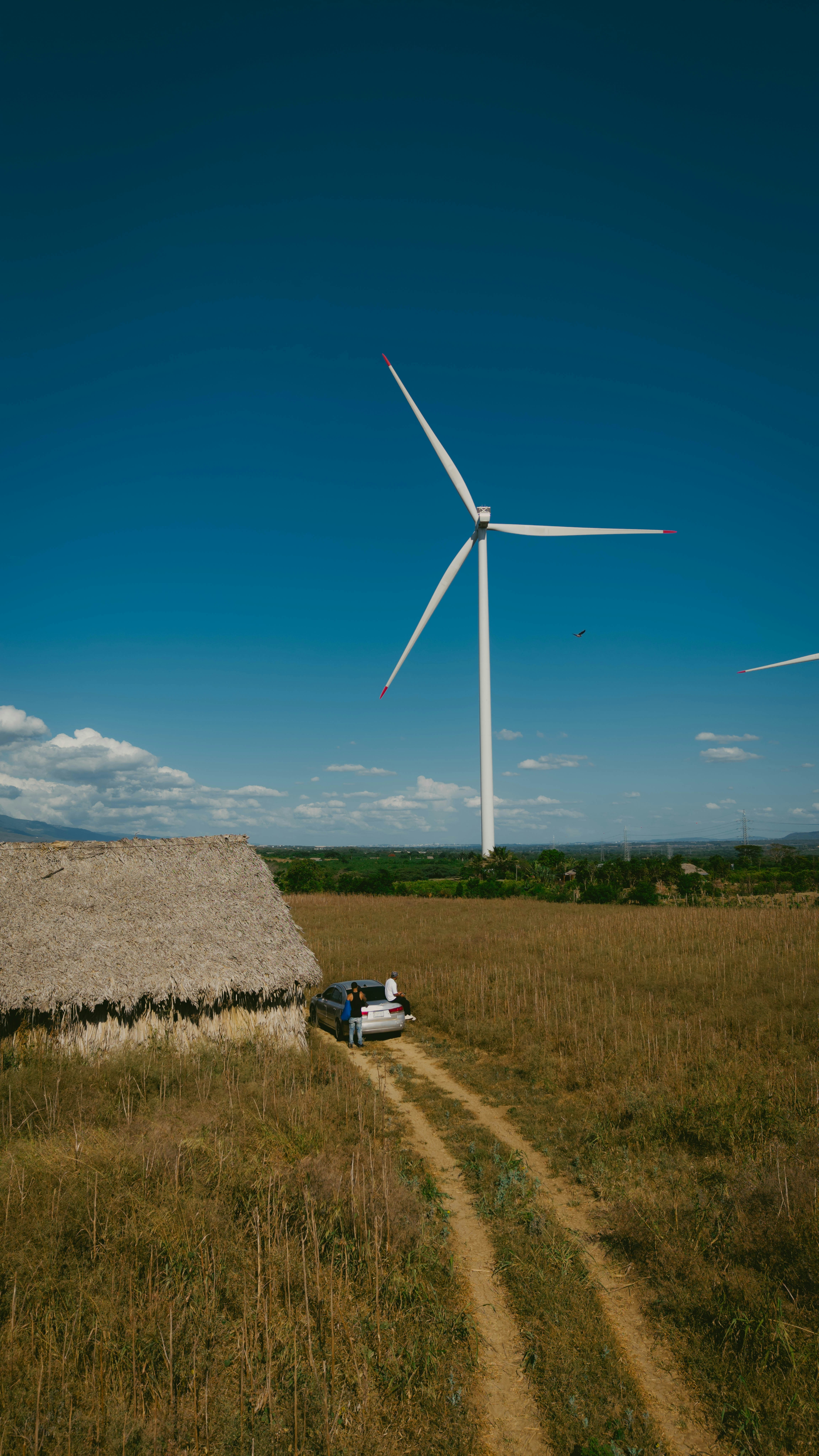 Windward Silence: A Wind Turbine over a Dusty Horizon