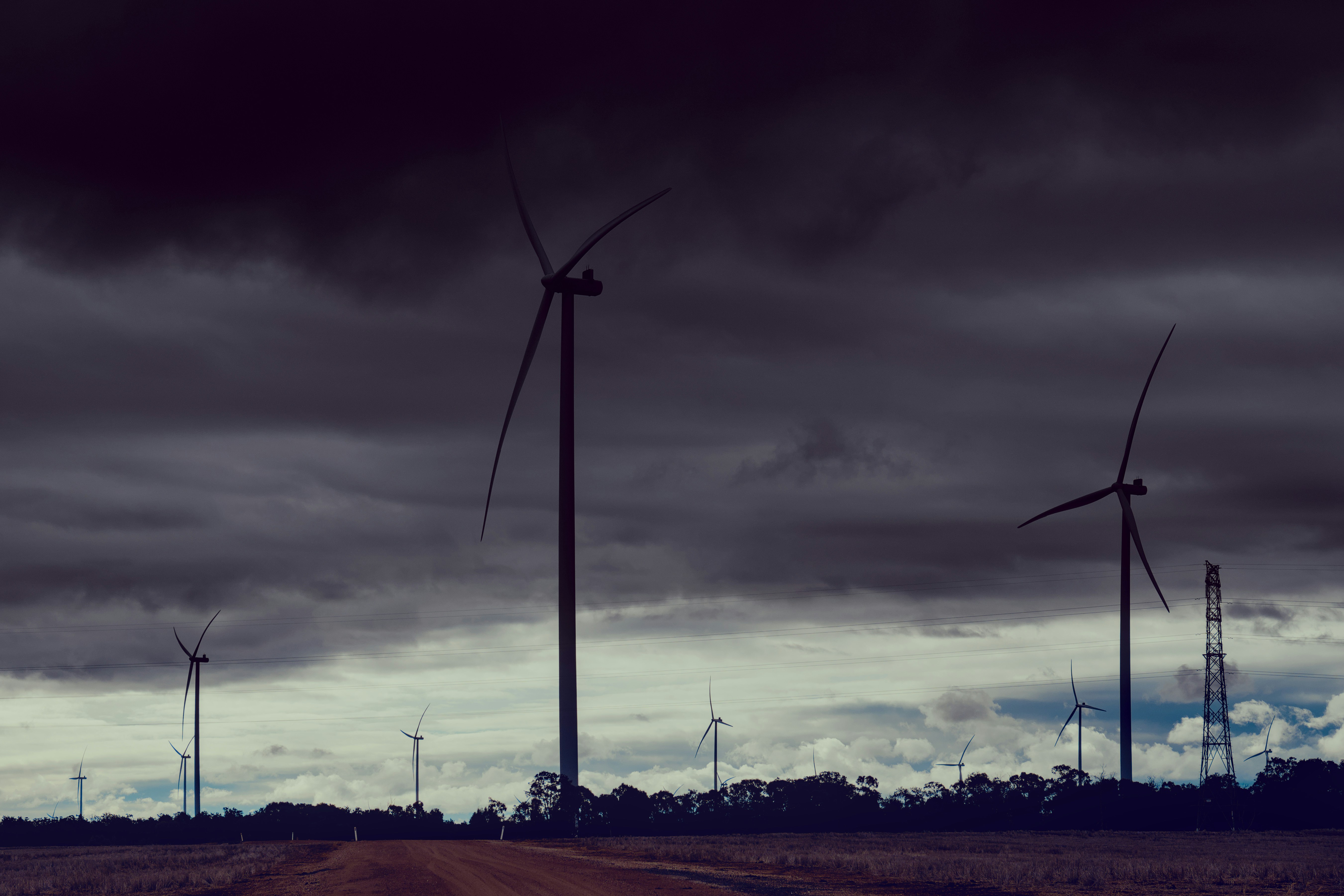 Dusk Giants: Wind Turbines Scatter the Flat Frontier
