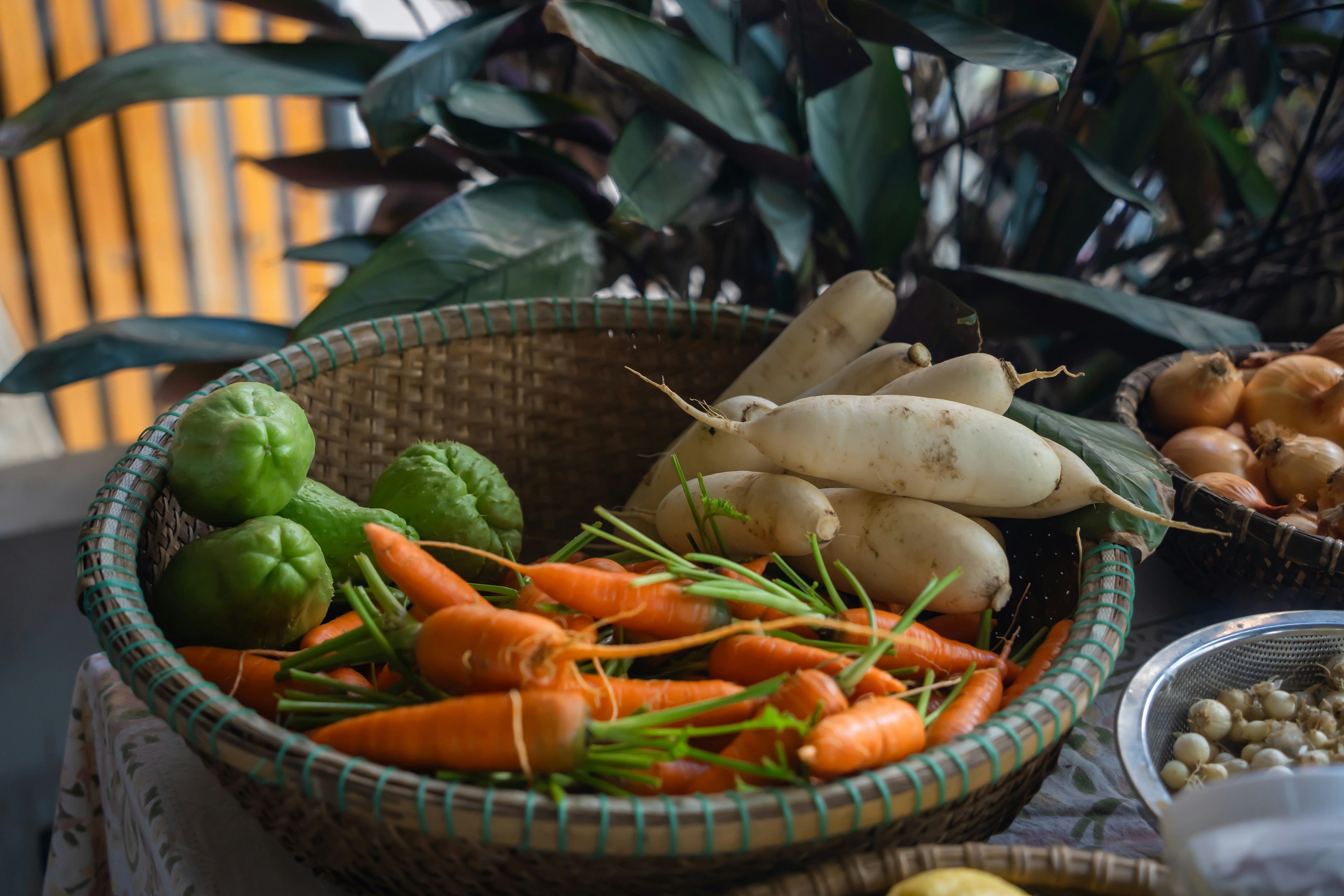 Harvest Basket: Vibrant Carrots and White Radishes Showcased in a Market Spread