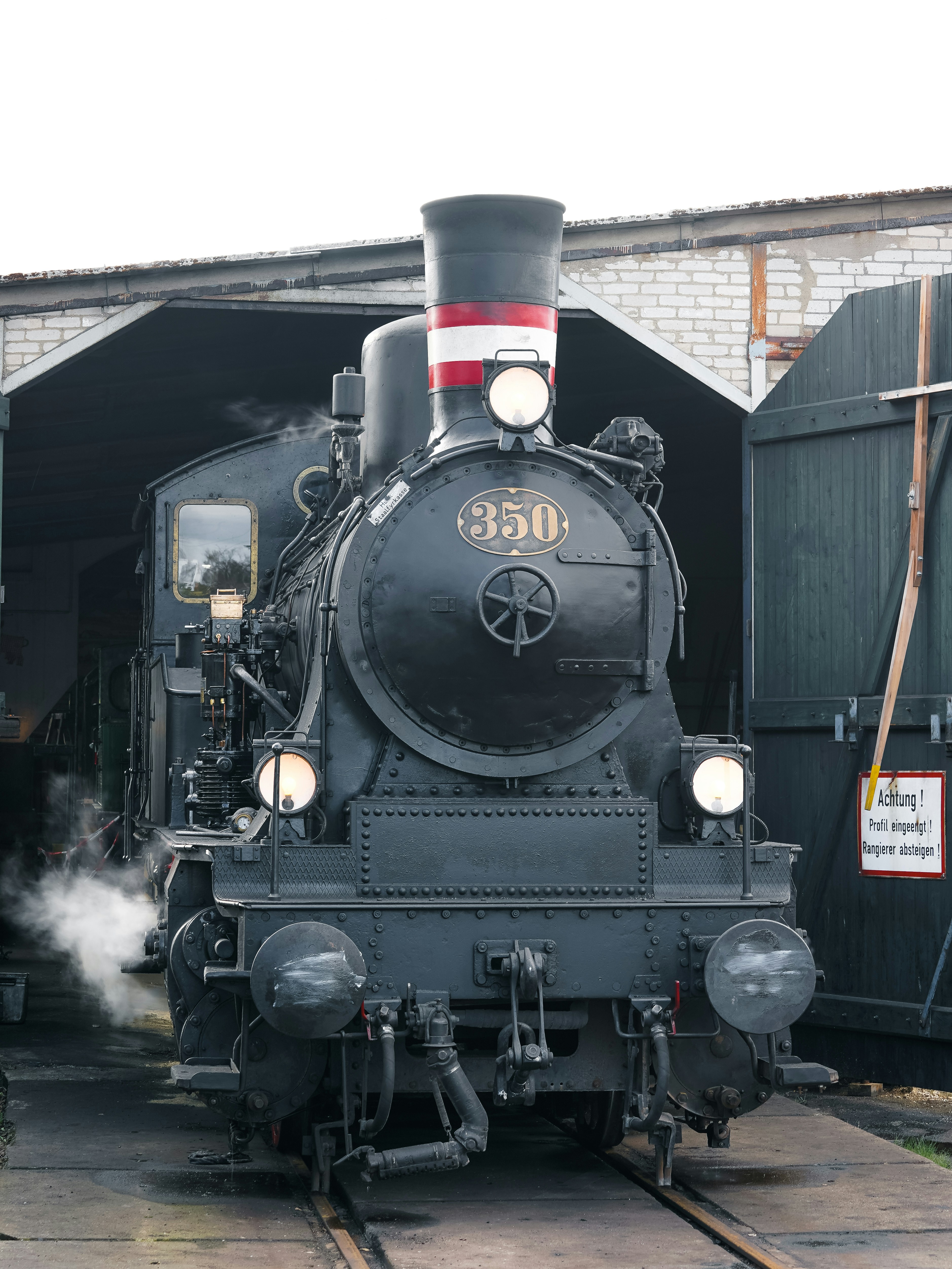 Front View of a Historic Steam Locomotive—Number 350 Emerging from the Shed