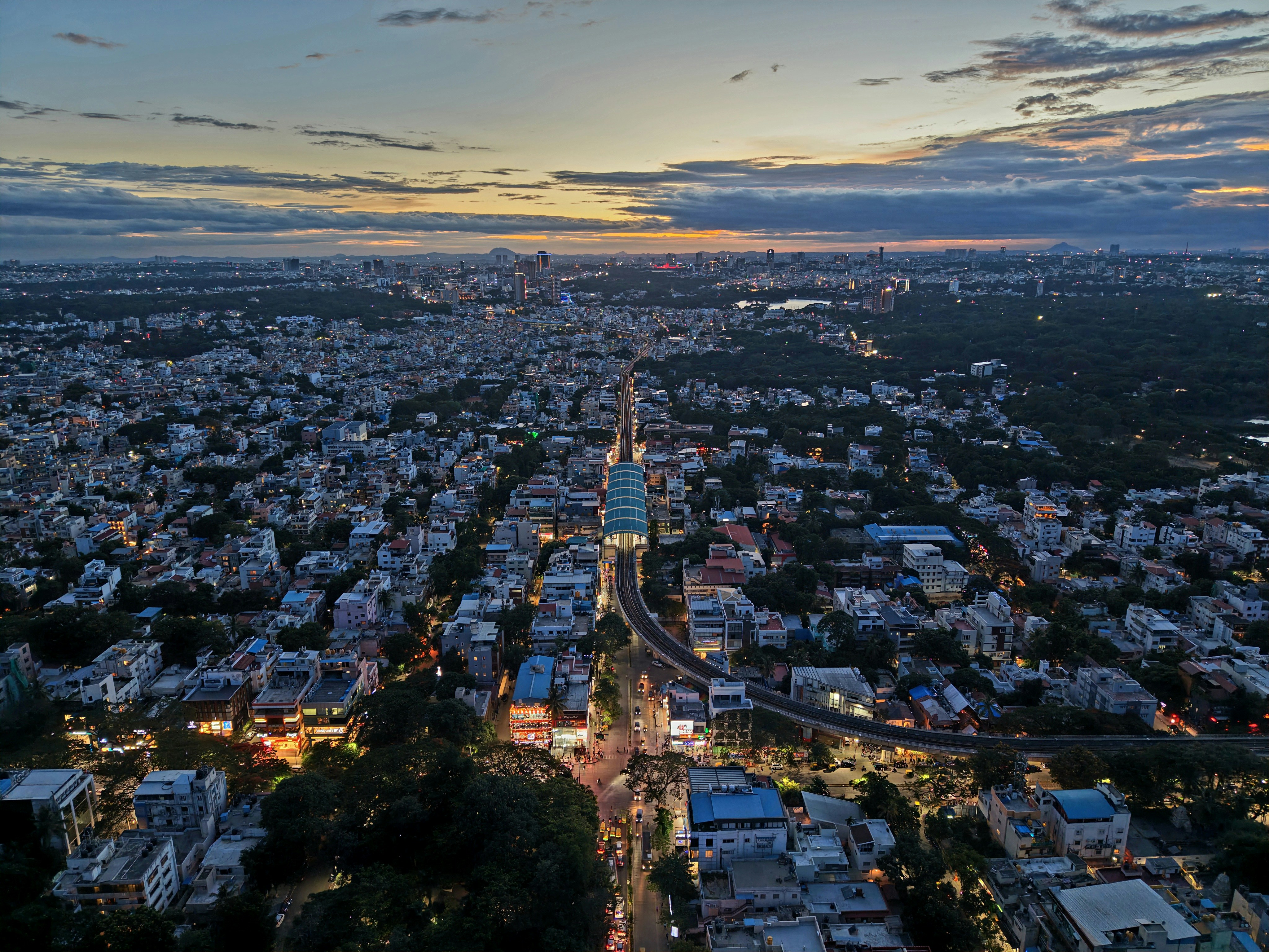 Aerial Arc: The City Spine Winding Toward the Horizon