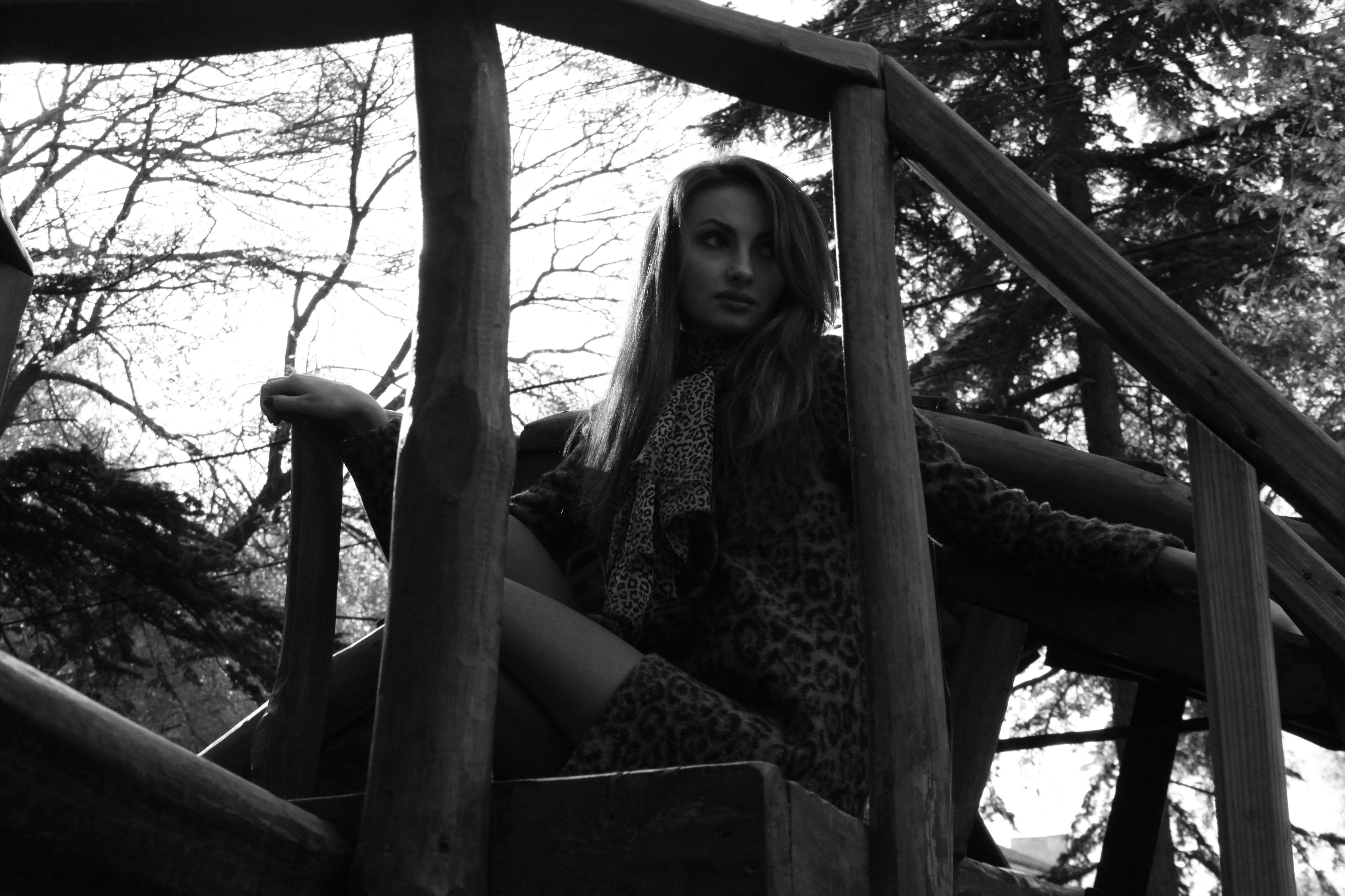 Girl on the Wooden Staircase: Moonlit Timber and Shadows