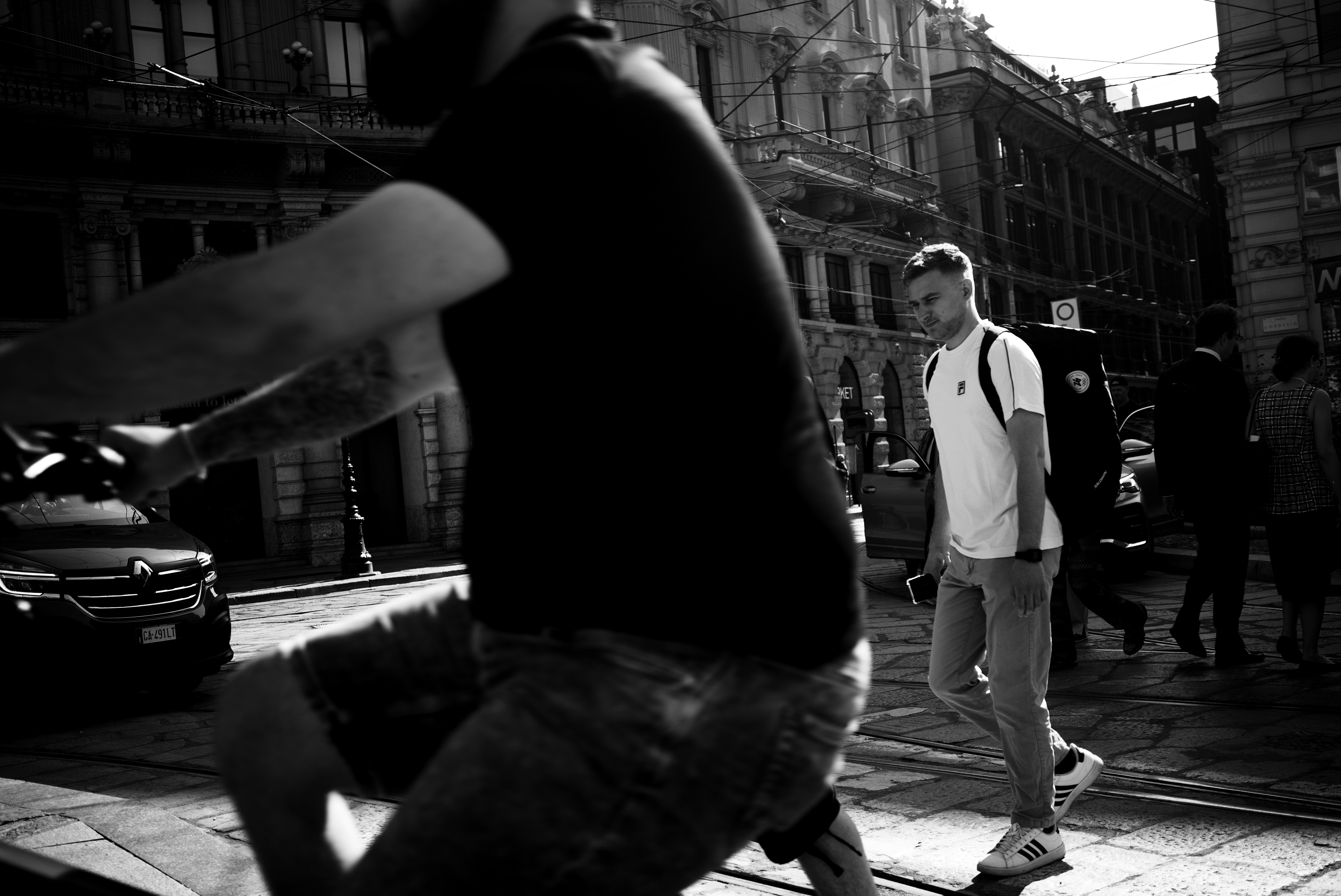 Stride in the Shadowed Street: A City Moment in Contrast