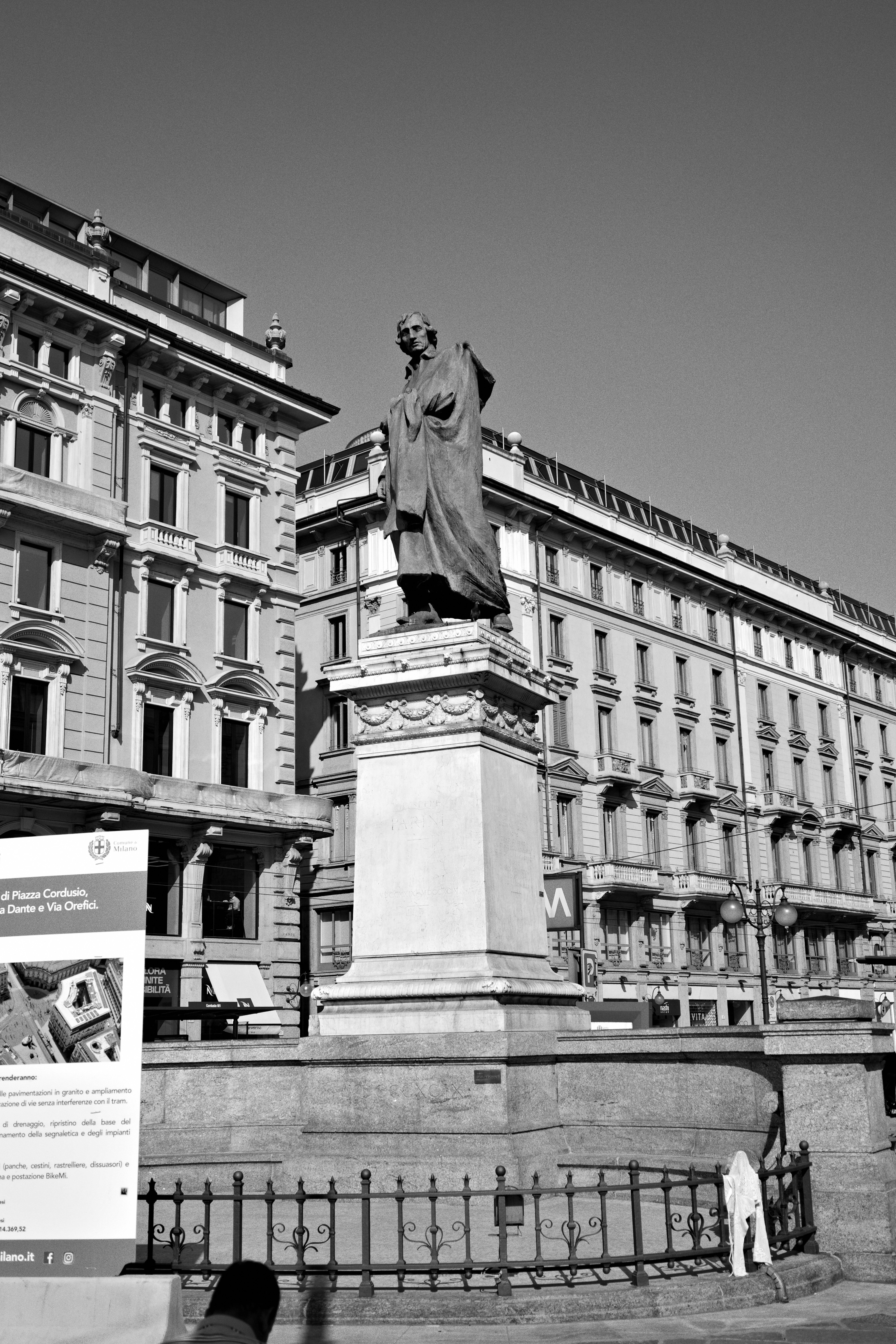 Stone Sentinel: a grand statue watching over a historic city square