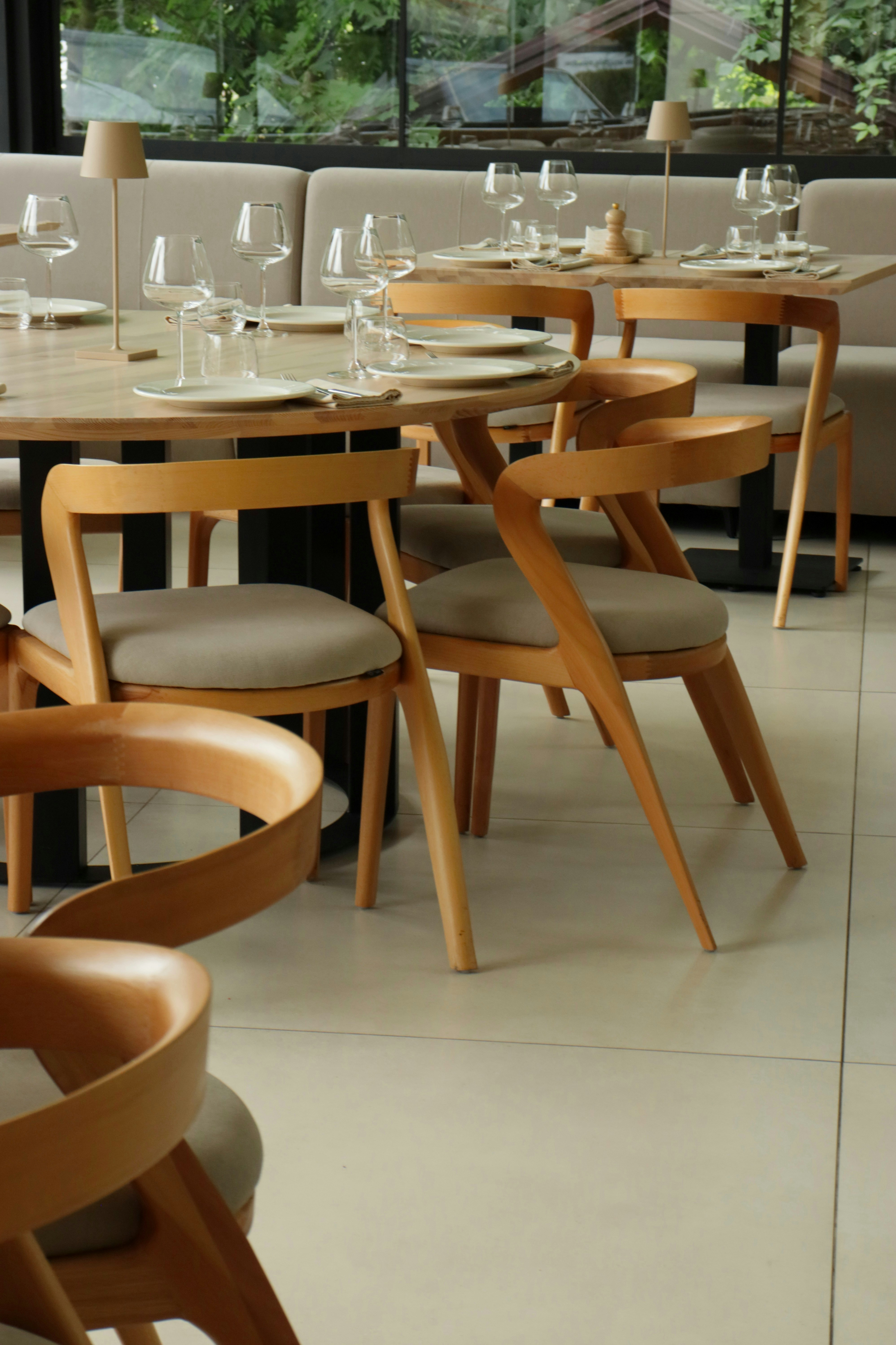 Sunlit Dining Nook: Wooden Chairs Circling a Quiet Table