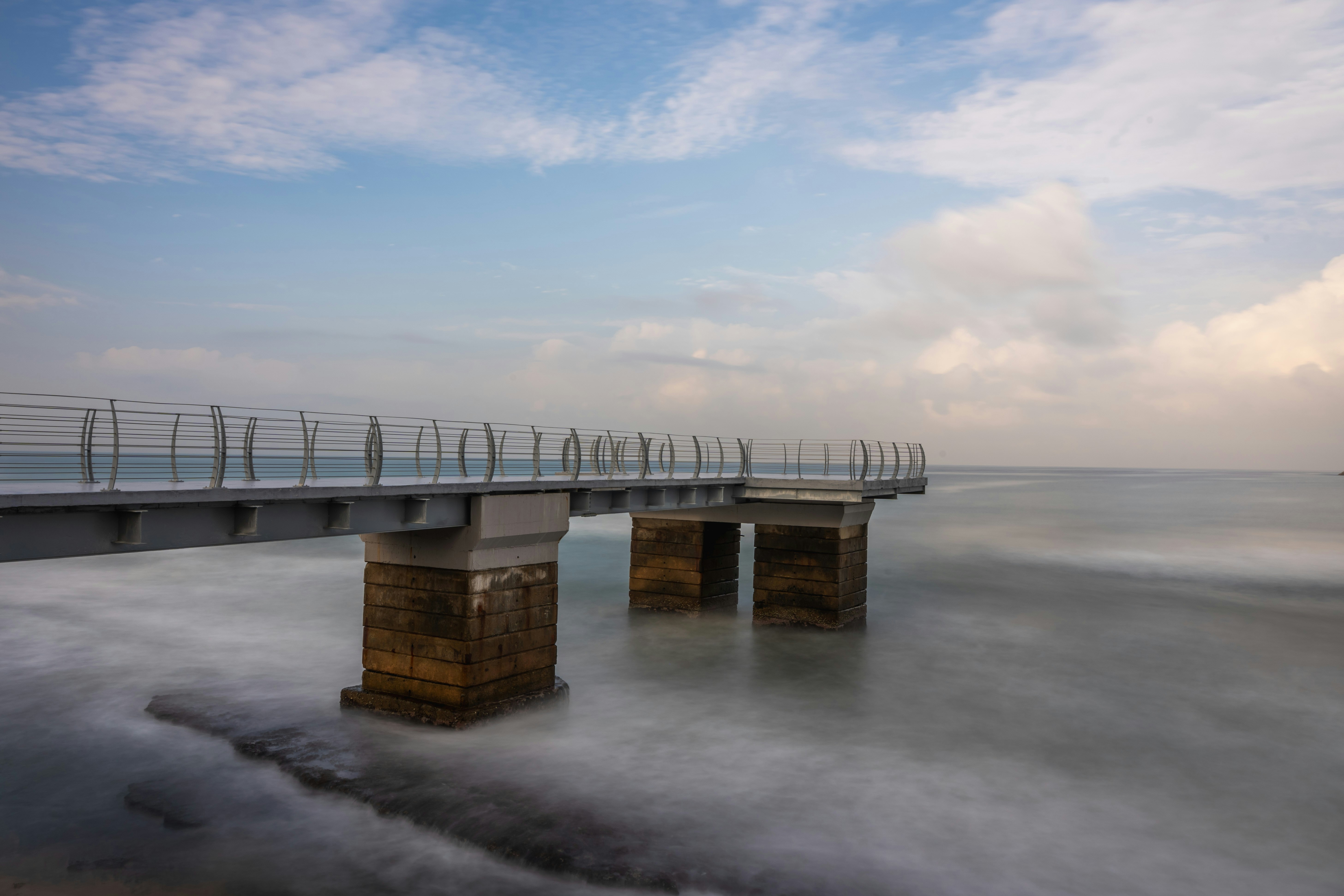 Pier into Distant Horizons: A Quiet Tide on Weathered Rails