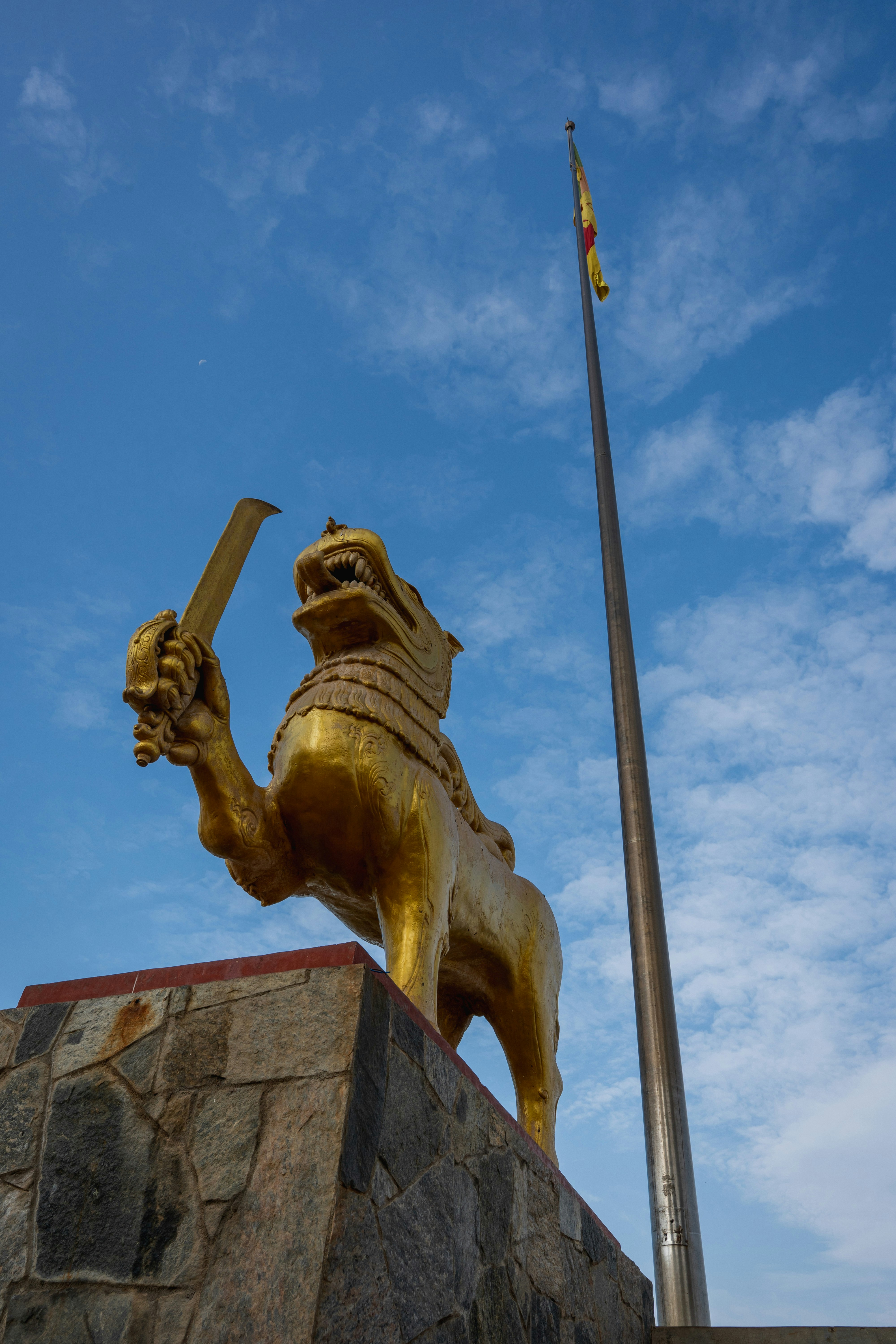Golden Guardian on the Stone Pedestal