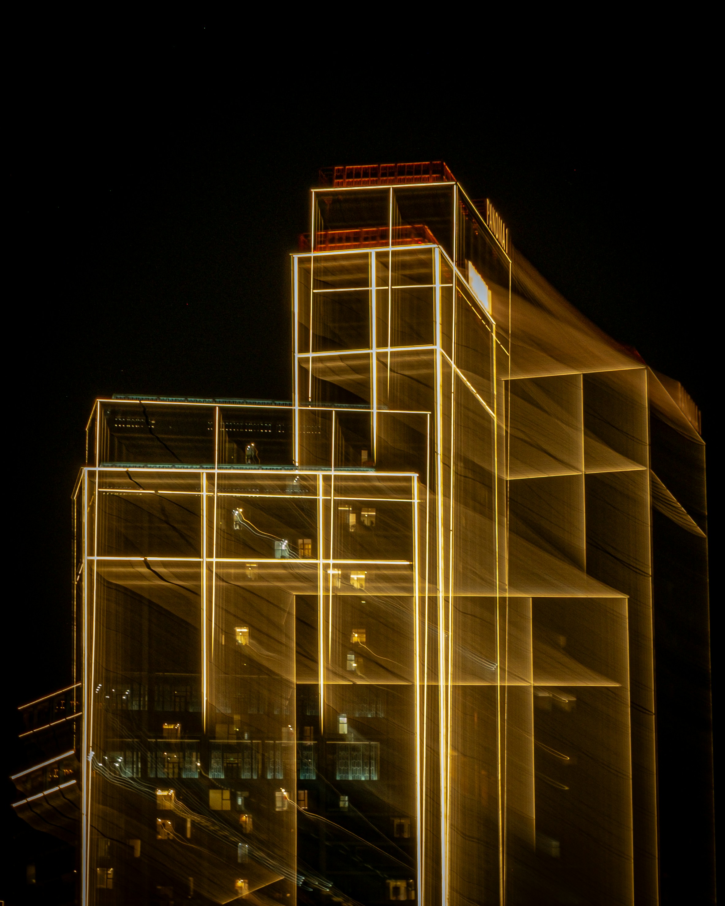 Glowing Glass Towers: Neon Edges in Midnight Silence