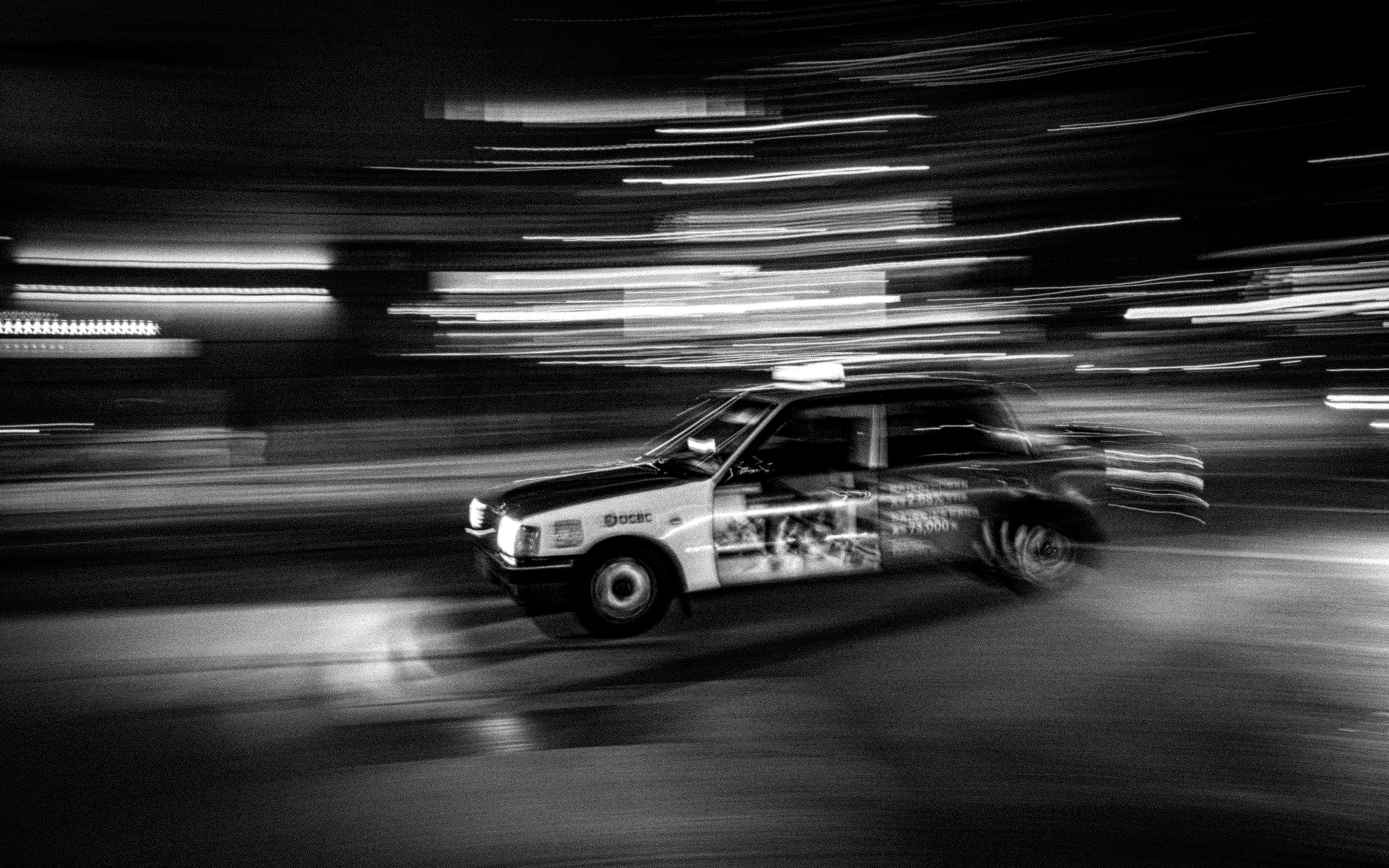 Night Streak: A rally truck cuts through neon smoke in motion