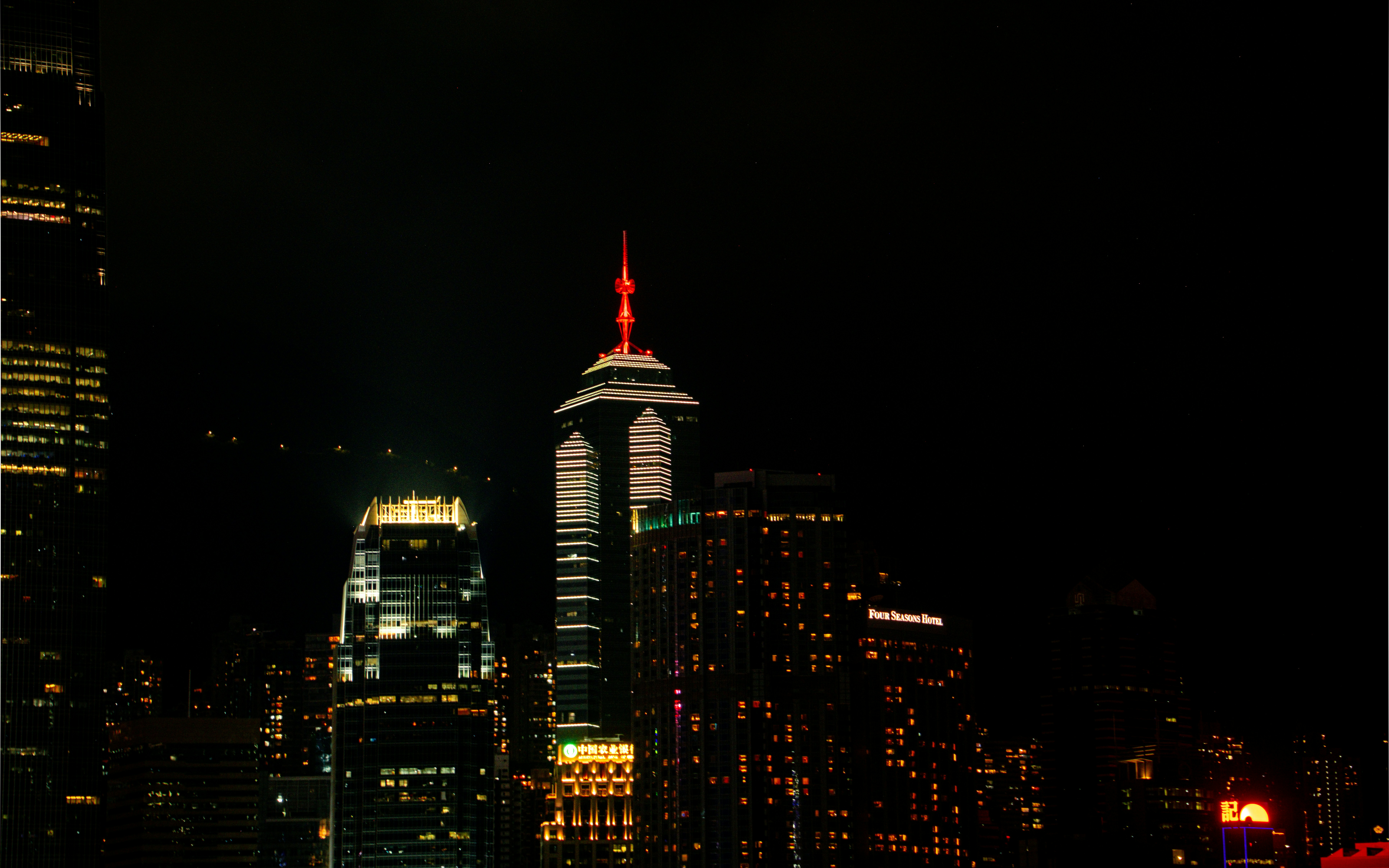 Midnight Needle: City Lights Crown a Silent Skyline