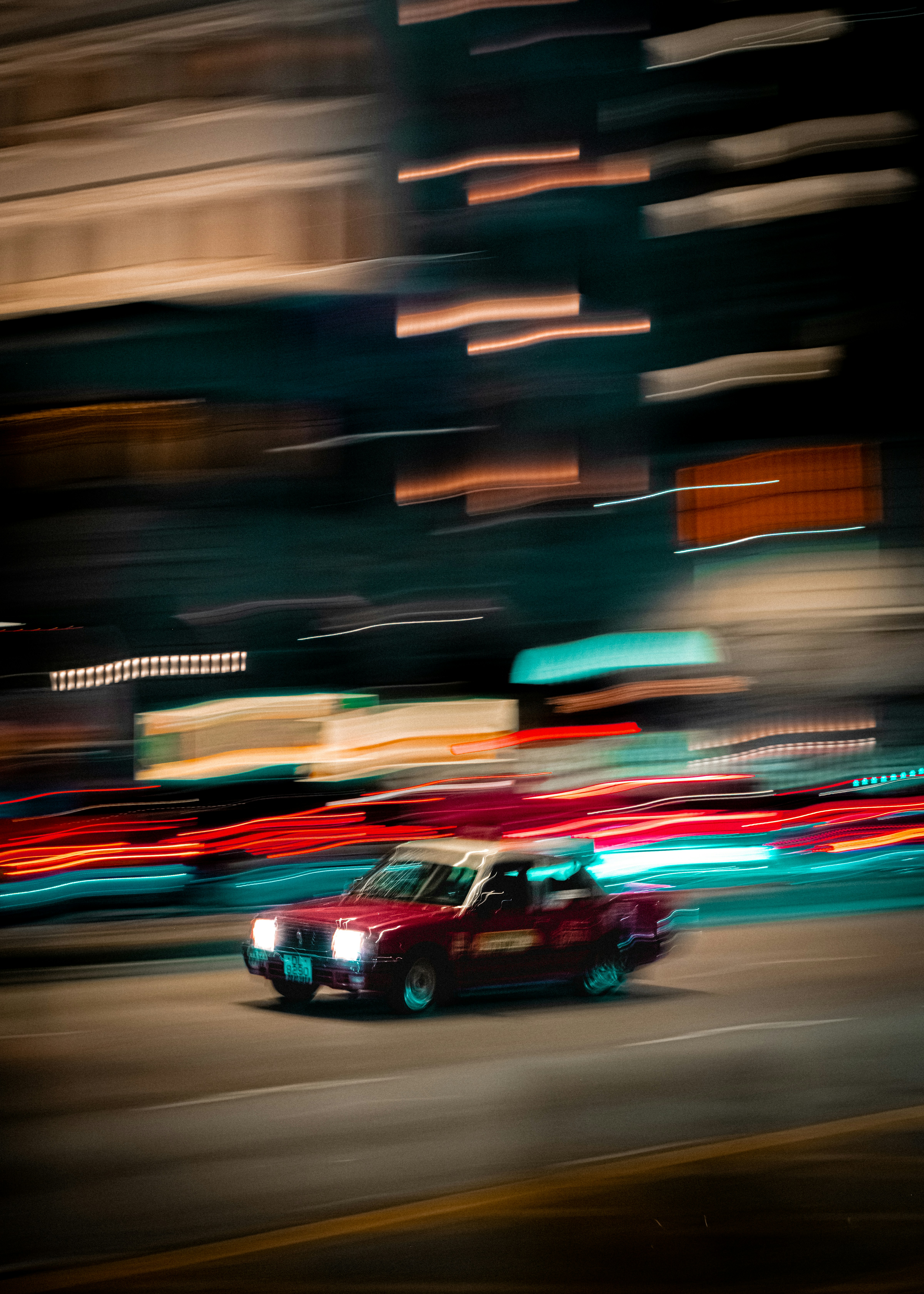 Night City Blur: A Red Pickup Speeds Through Neon Haze