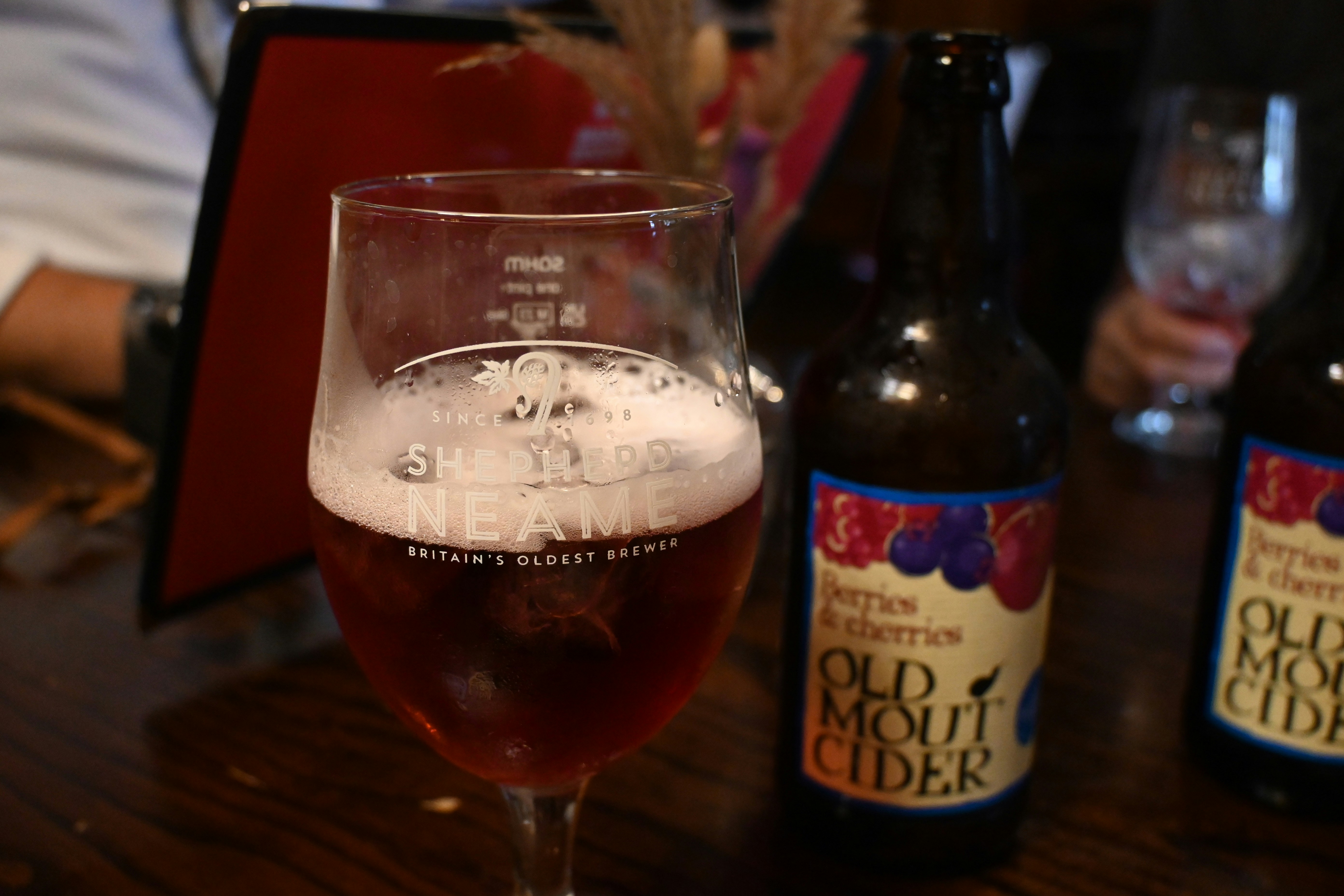 A Glass of Autumn Ale Joel: Bottles and Brew on a Cozy Bar