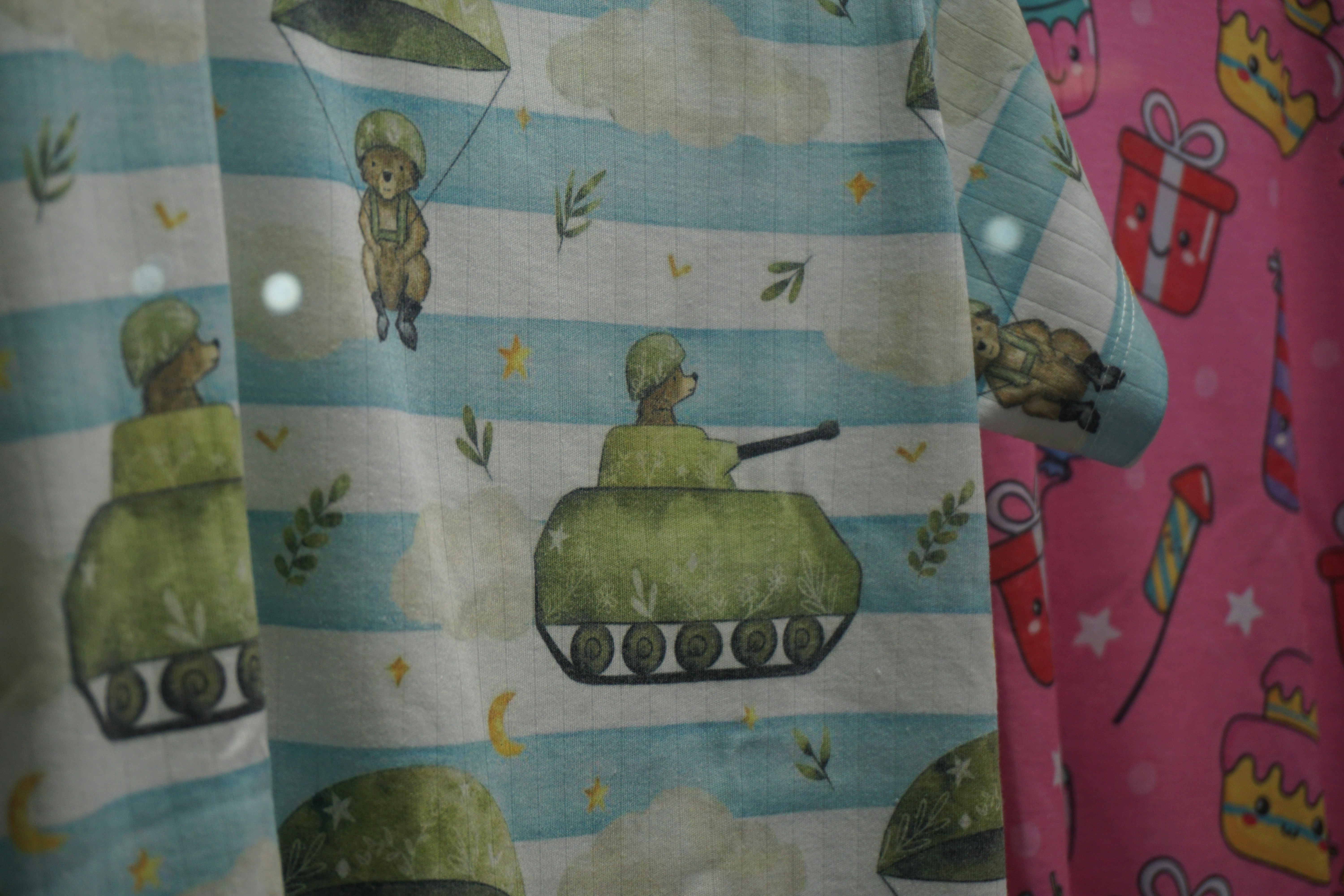 Playful Armored Tracks: A Fabric Pattern Portrait of Tanks and Toys