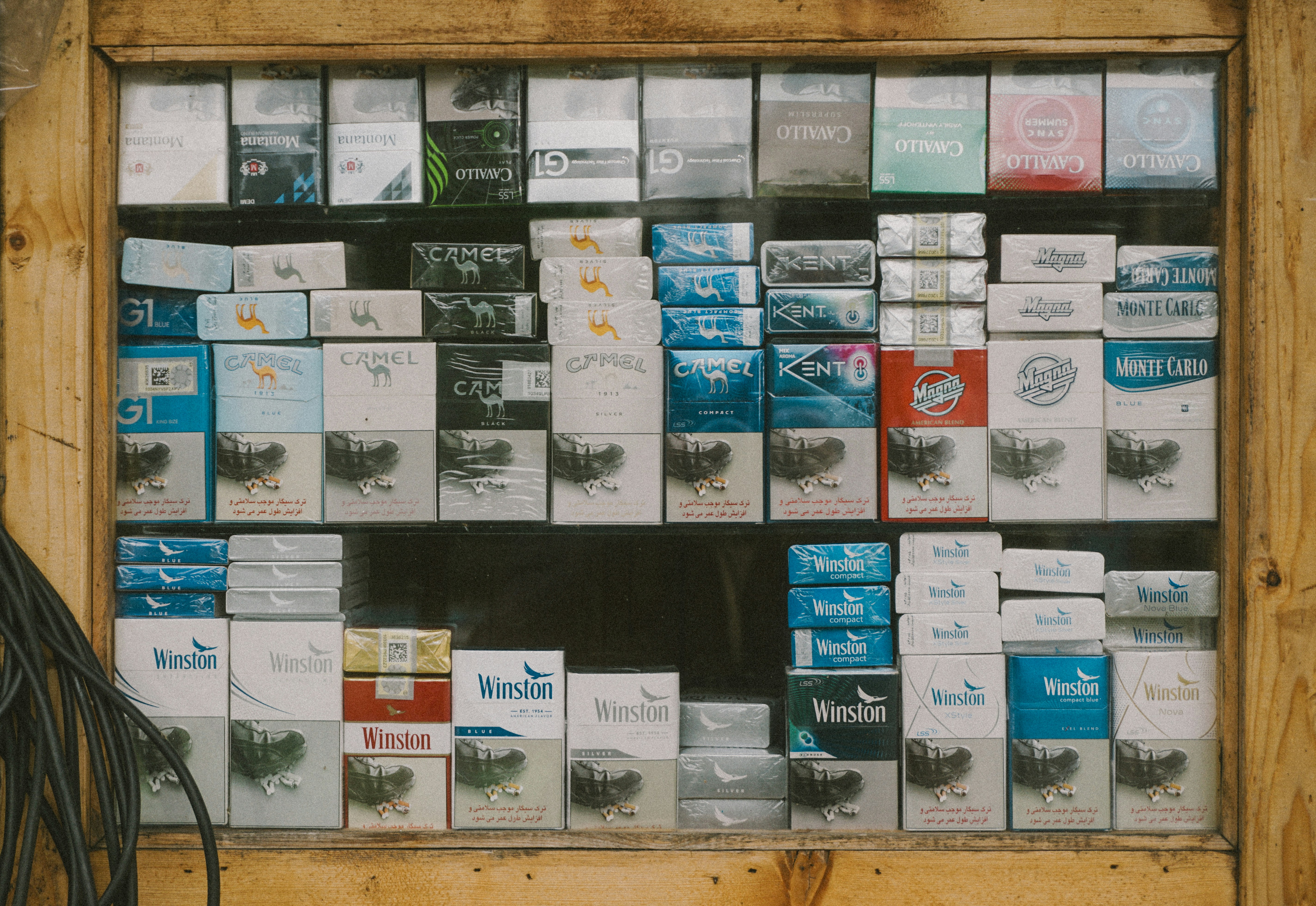 Arranged Mists of Menthol: A Window Display of Cigarette Packs
