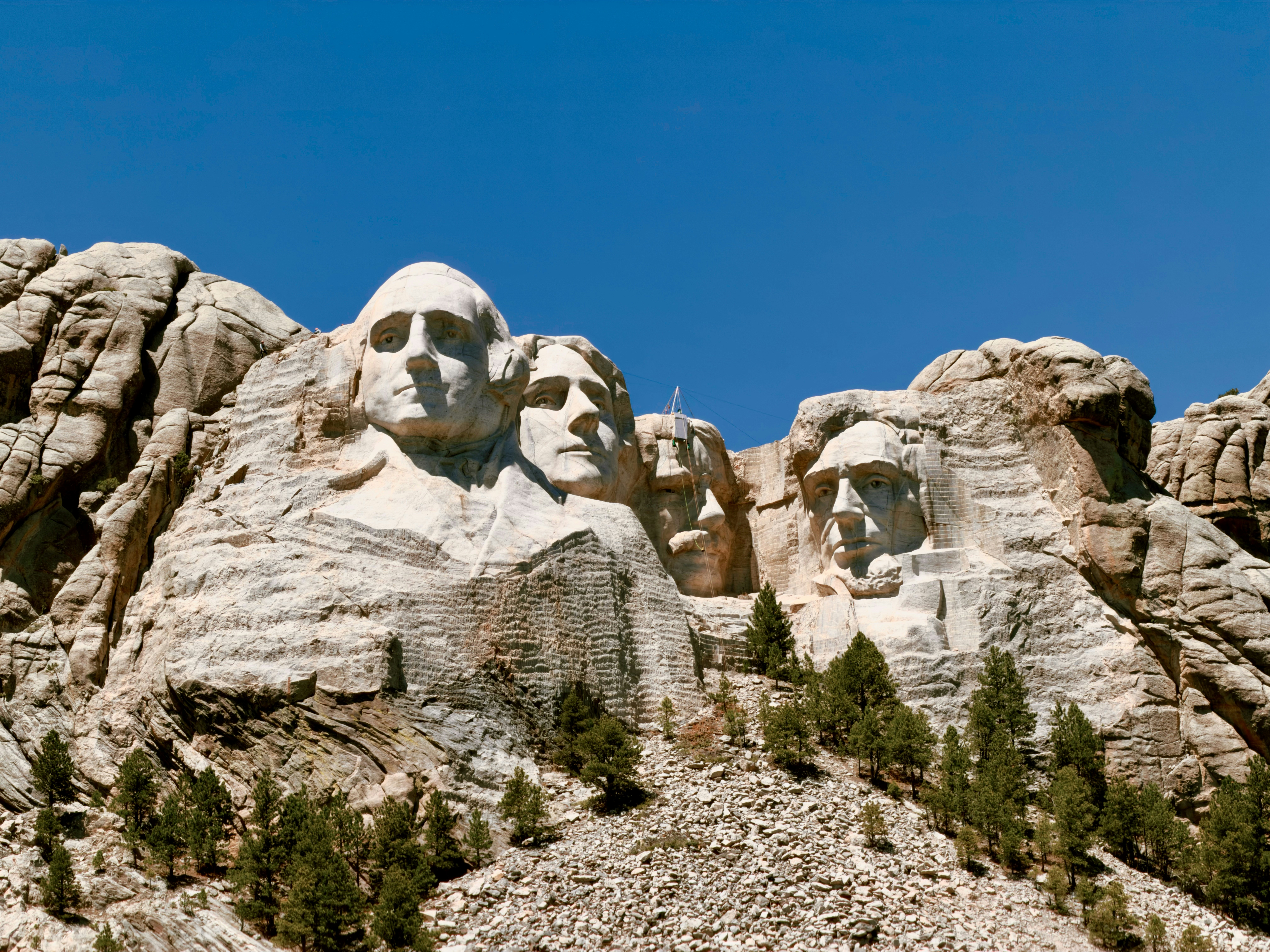 Mount Rushmore Under a Blue Sky: Faces Carved in Stone