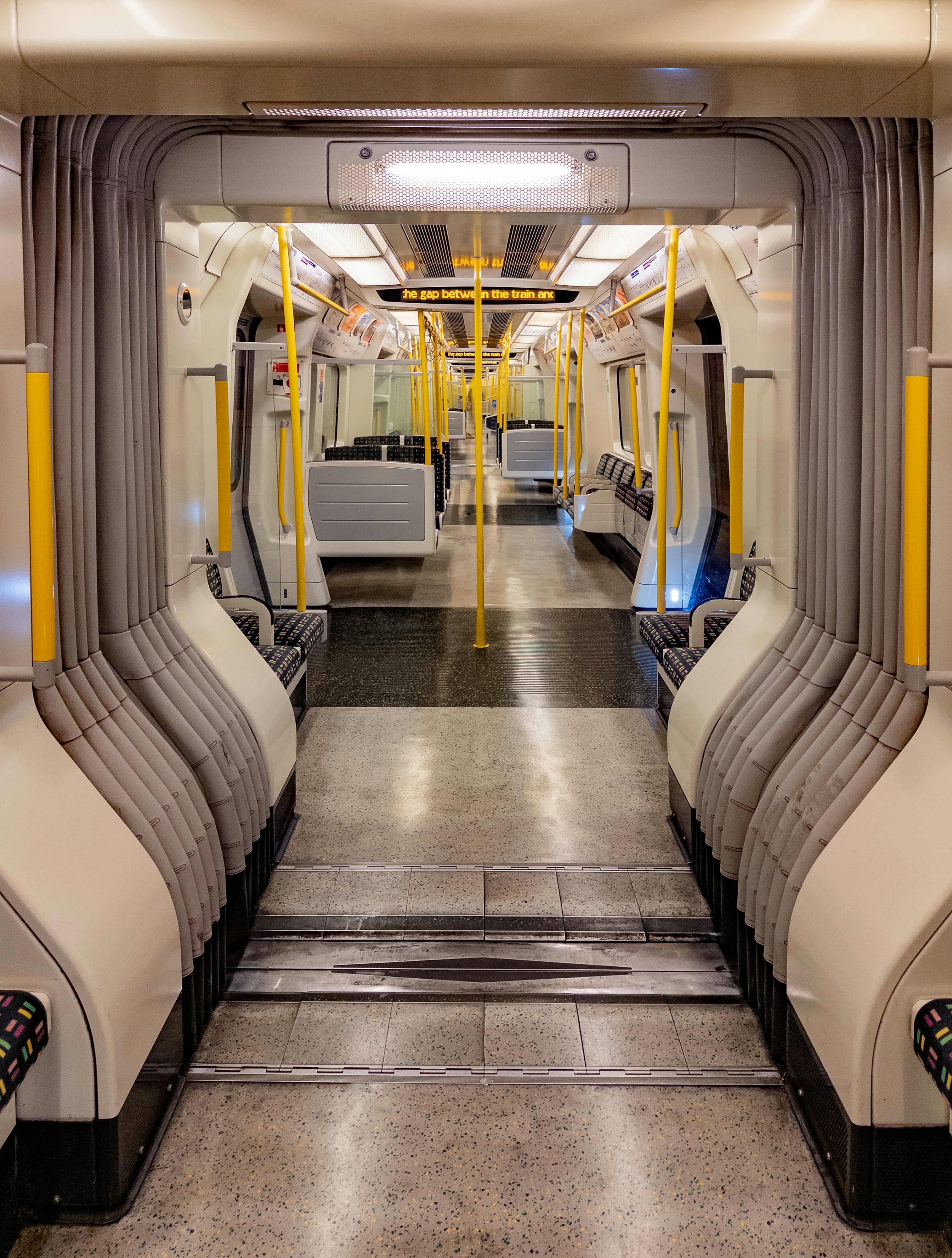 Symmetrical Transit: Centered Aisle of Yellow Poles