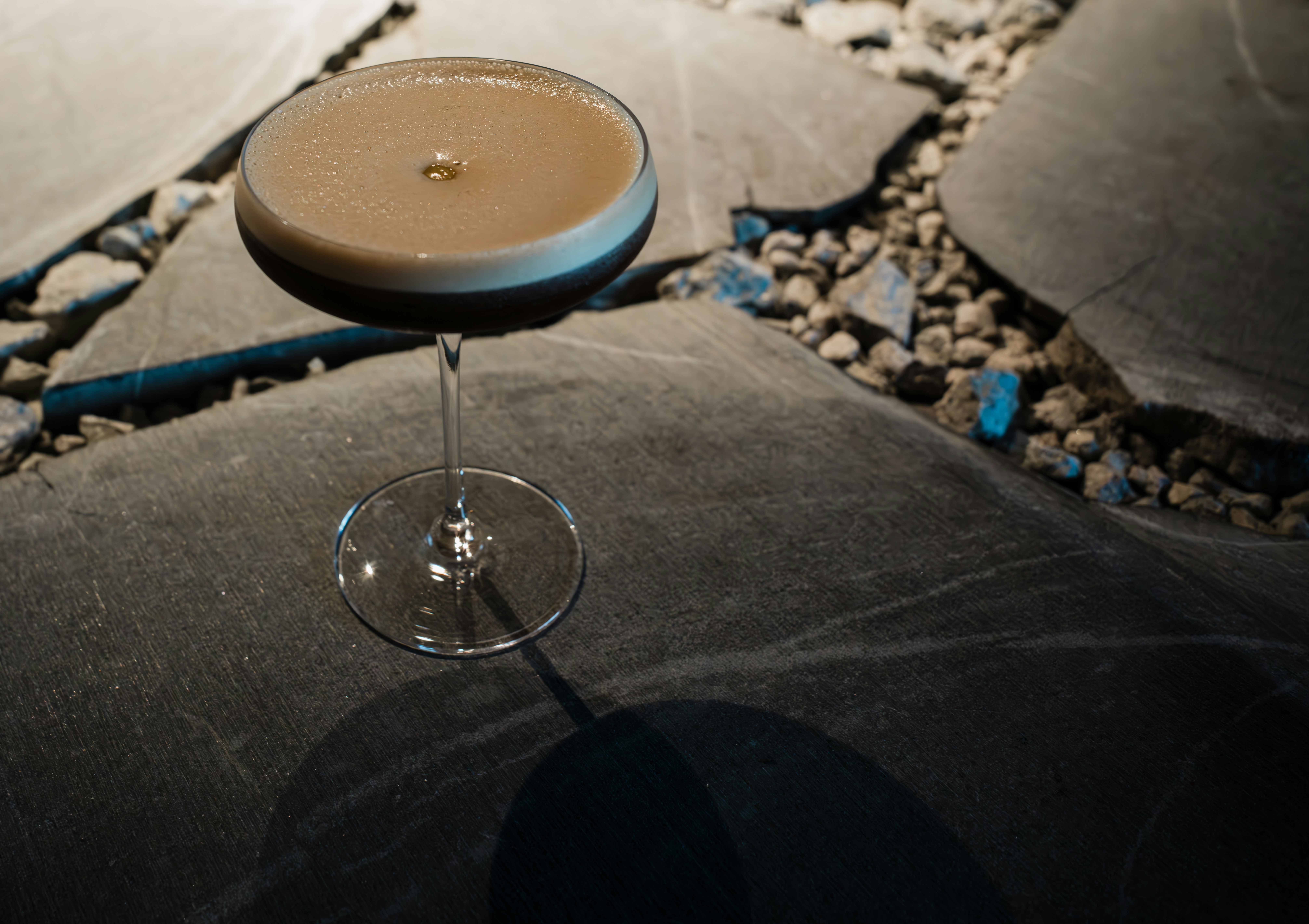 Moonlit Martini: A Hazy Glass in a Stone Garden