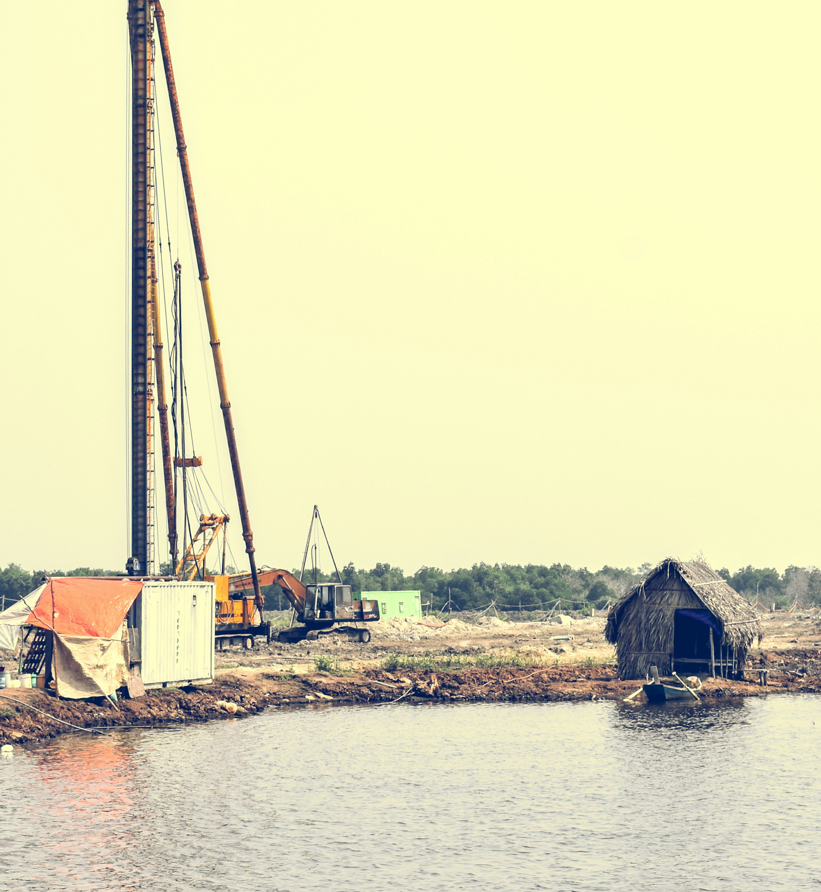 Harbor Construction Dawn: Cranes and Hut by the Quiet Water