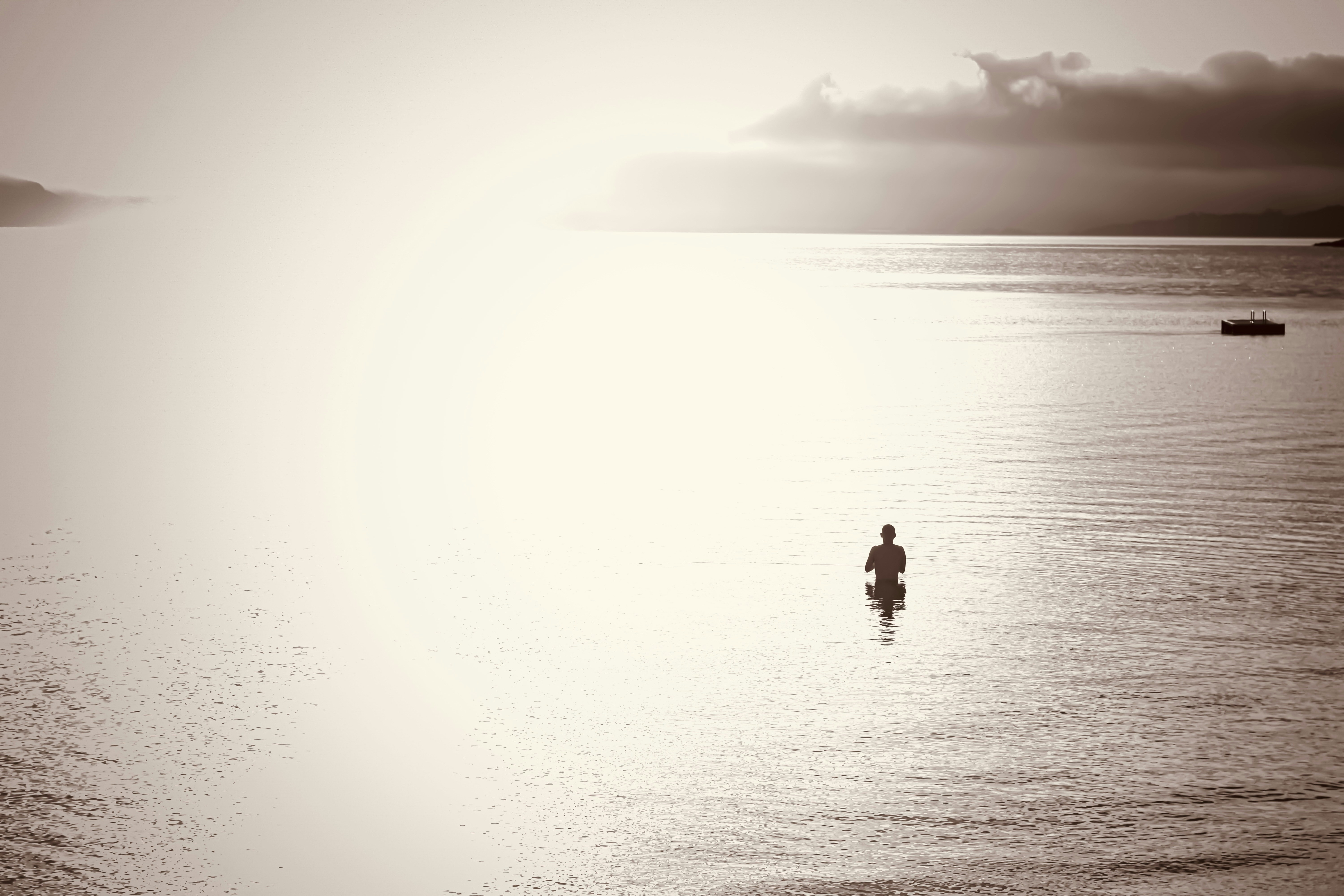 Solitary Figure Stands in a Misty Evening Sea