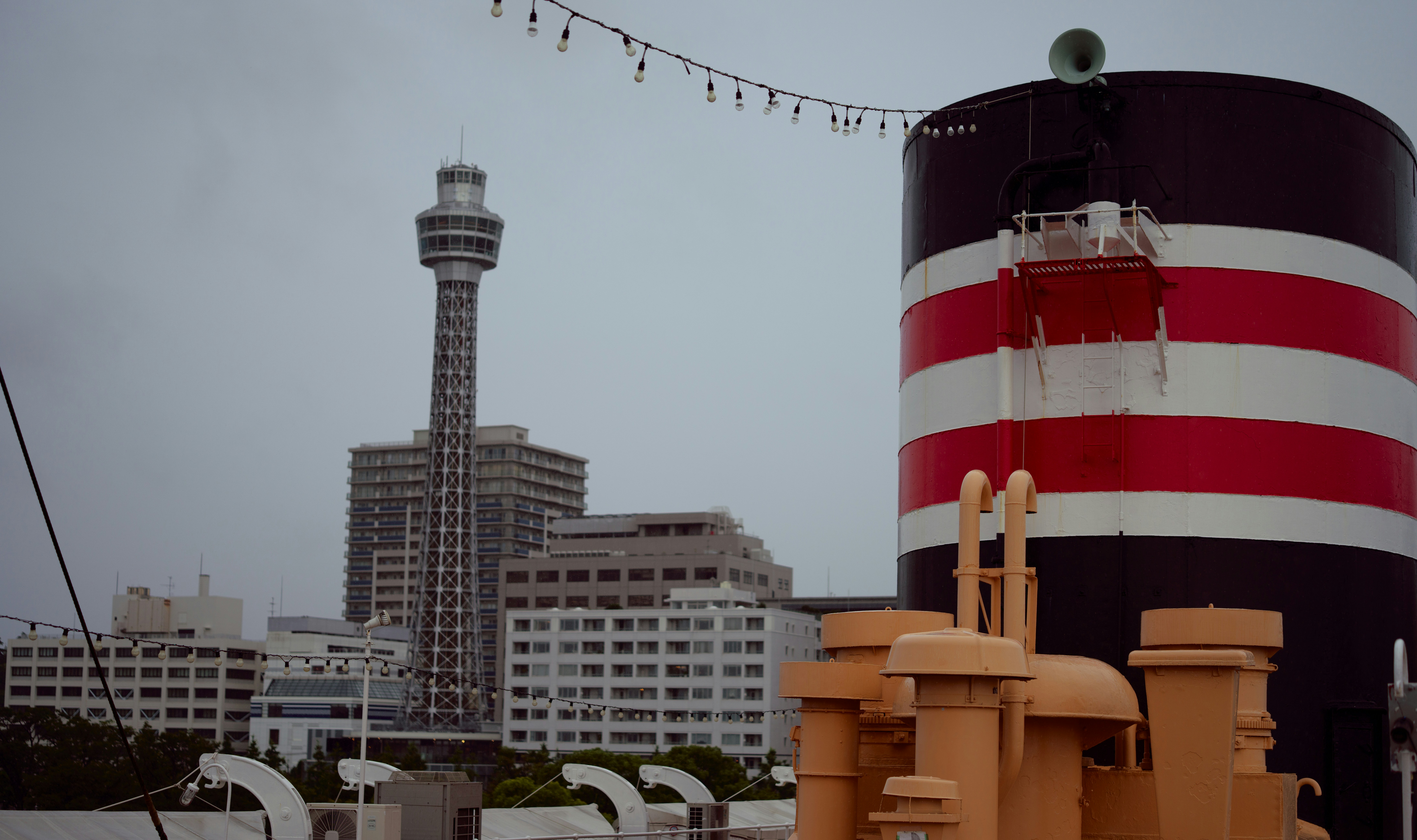 Harbor Signals: Industrial Structures Framing a Tower