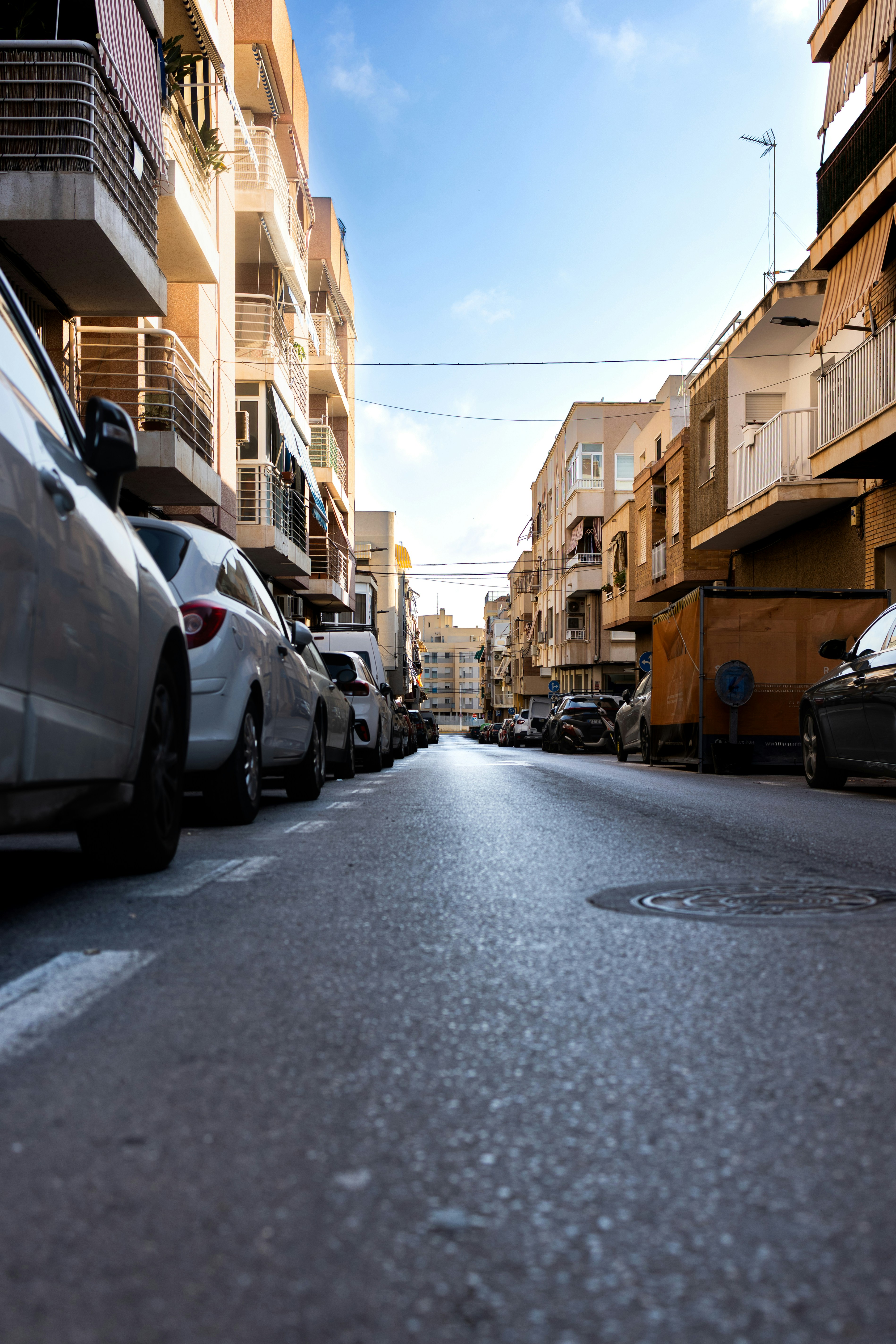 Urban Avenue Converging Toward the Horizon