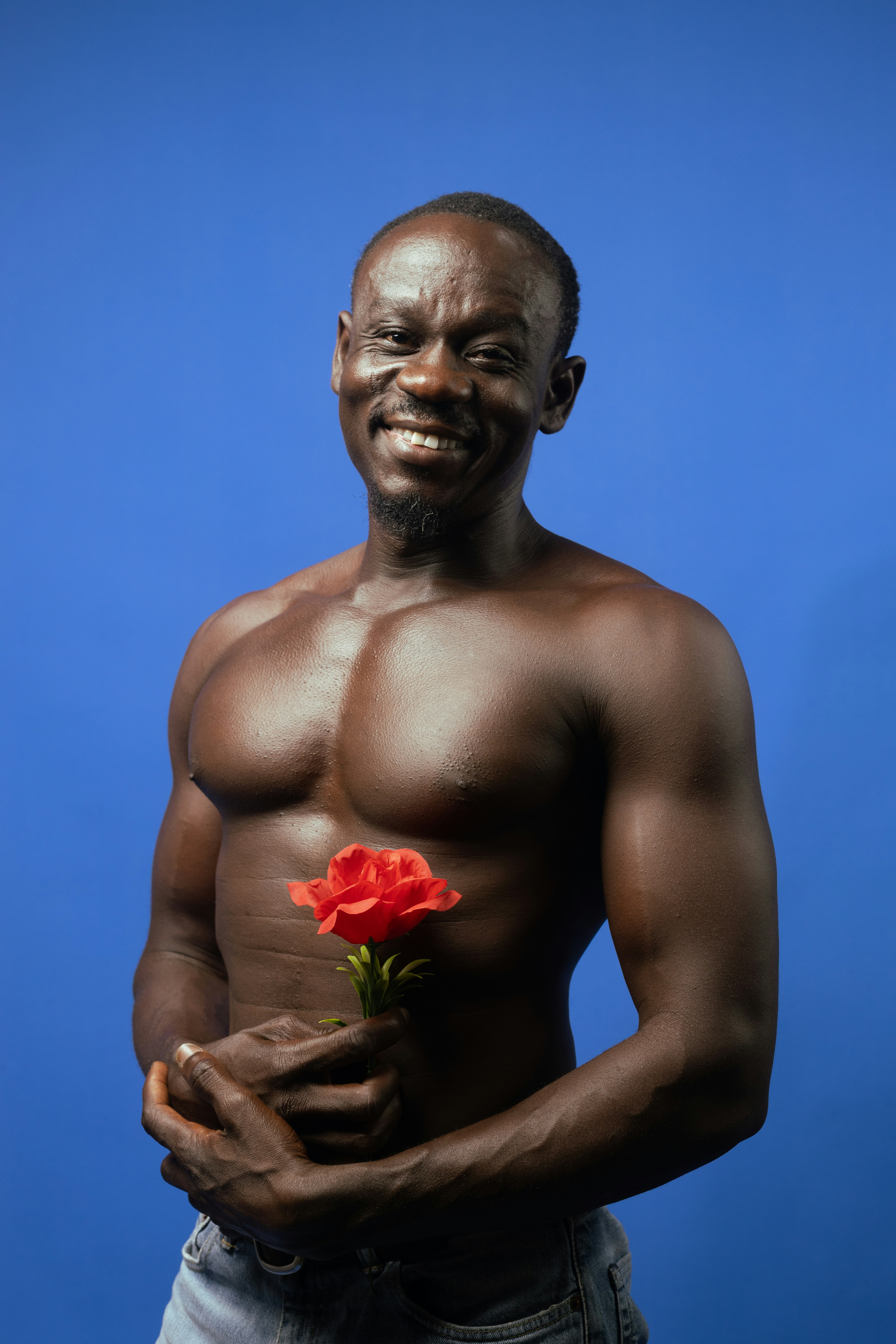 Gentleman with Scarlet Bloom Against a Velvet Blue
