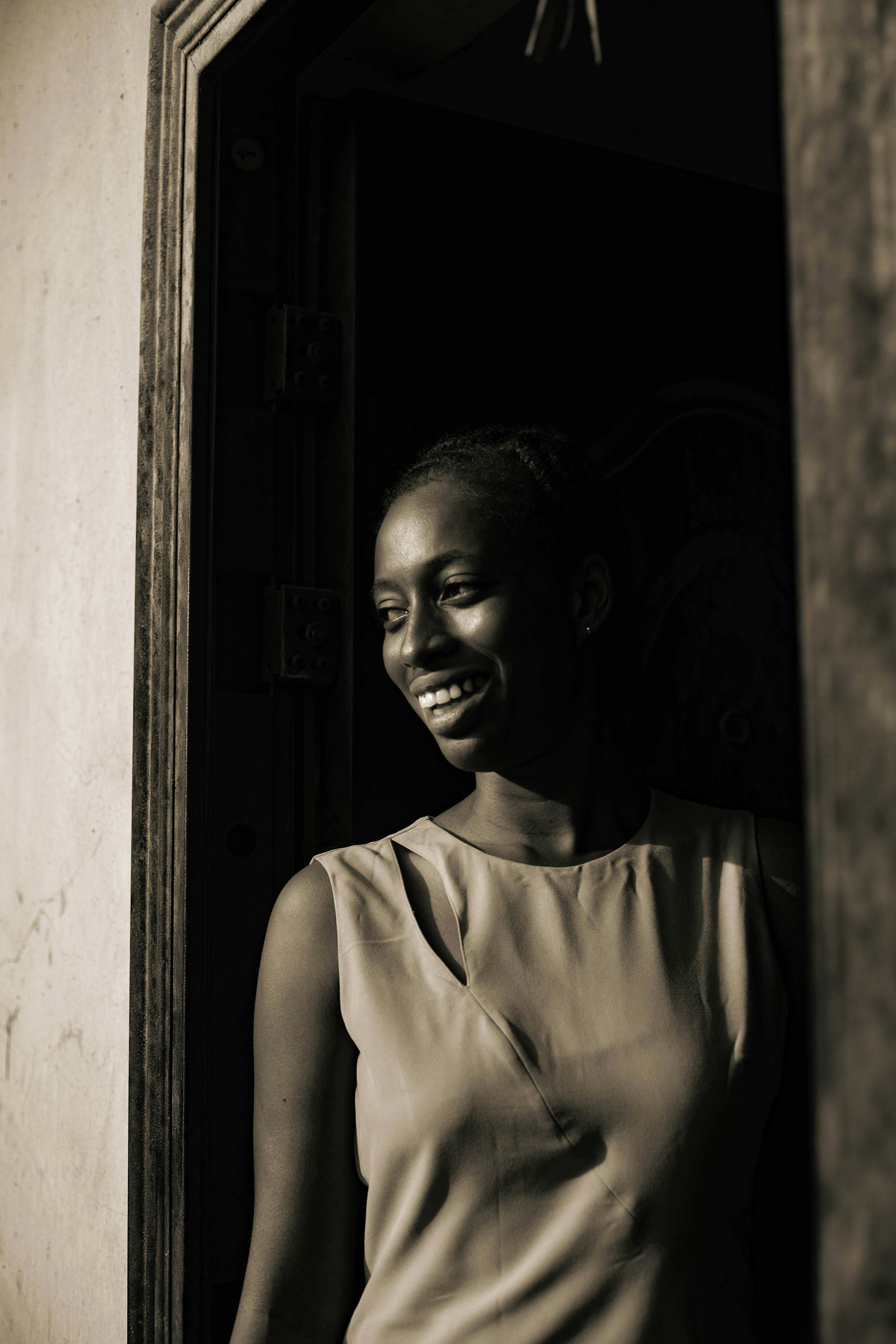 Portrait in Shadow: A Warm Smile at the Threshold of Light