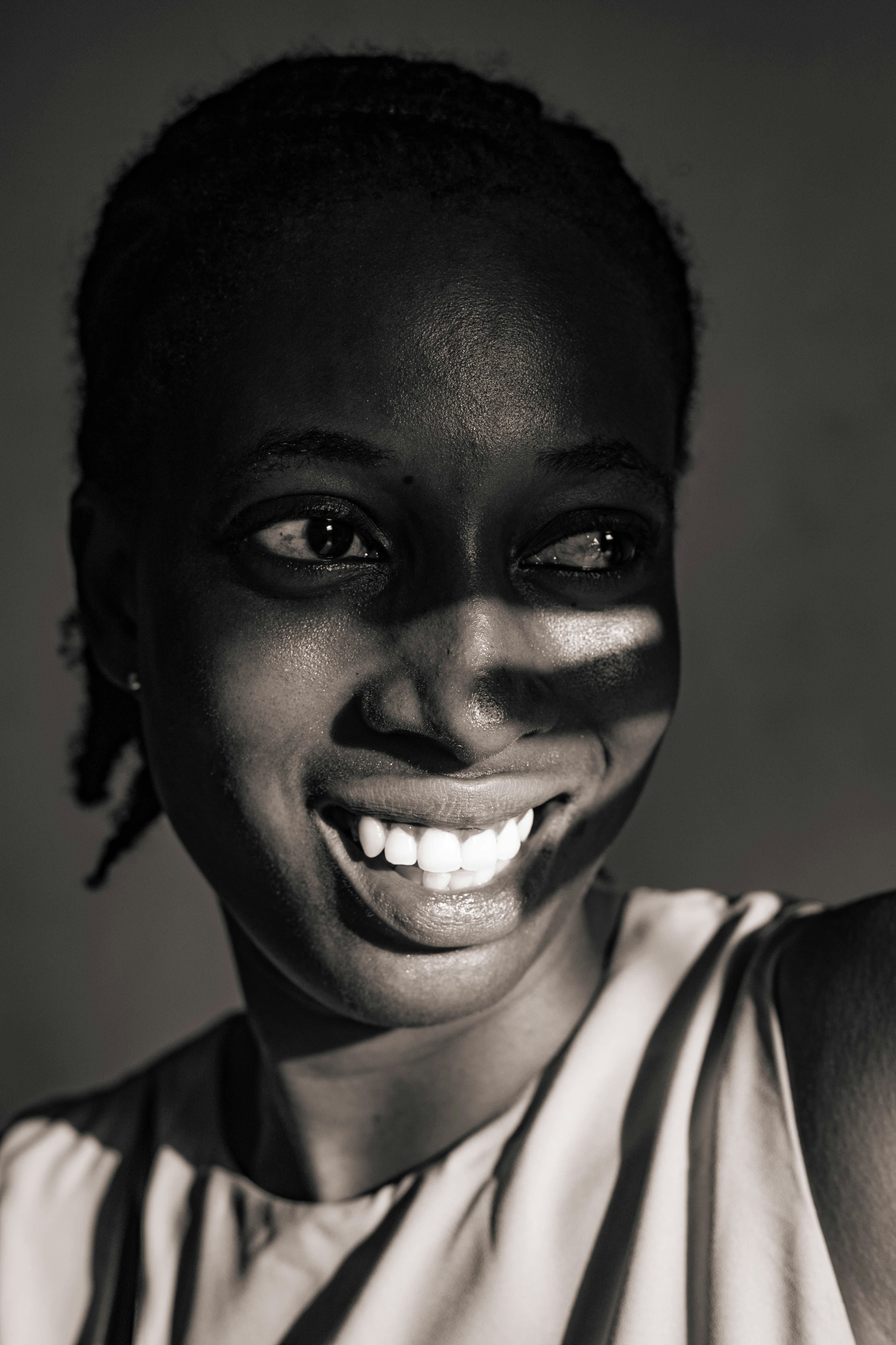 Bright Smile in Soft Shadow: Portrait of Confidence