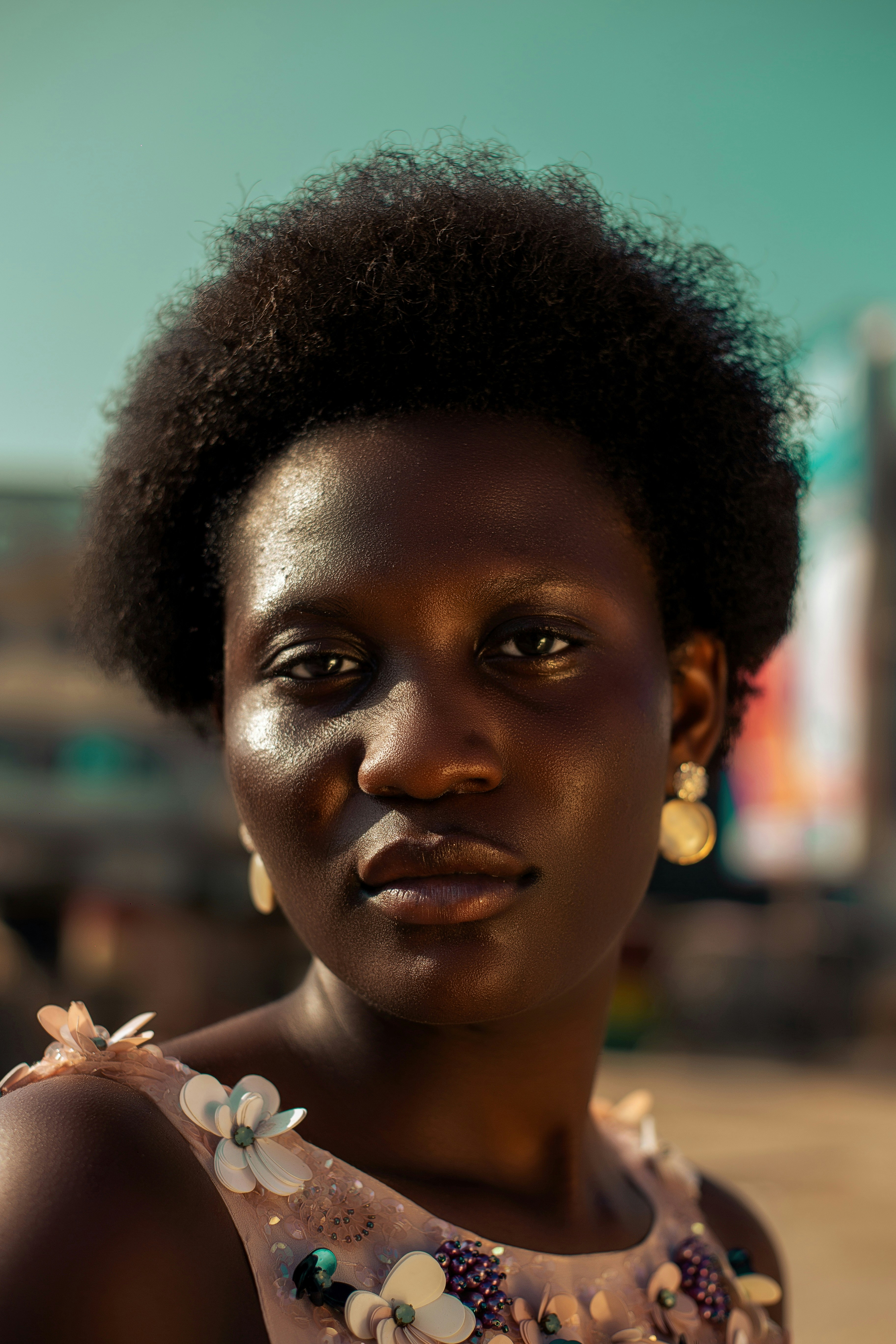 Grace in Focus: Portrait Under Sea-green Backdrop