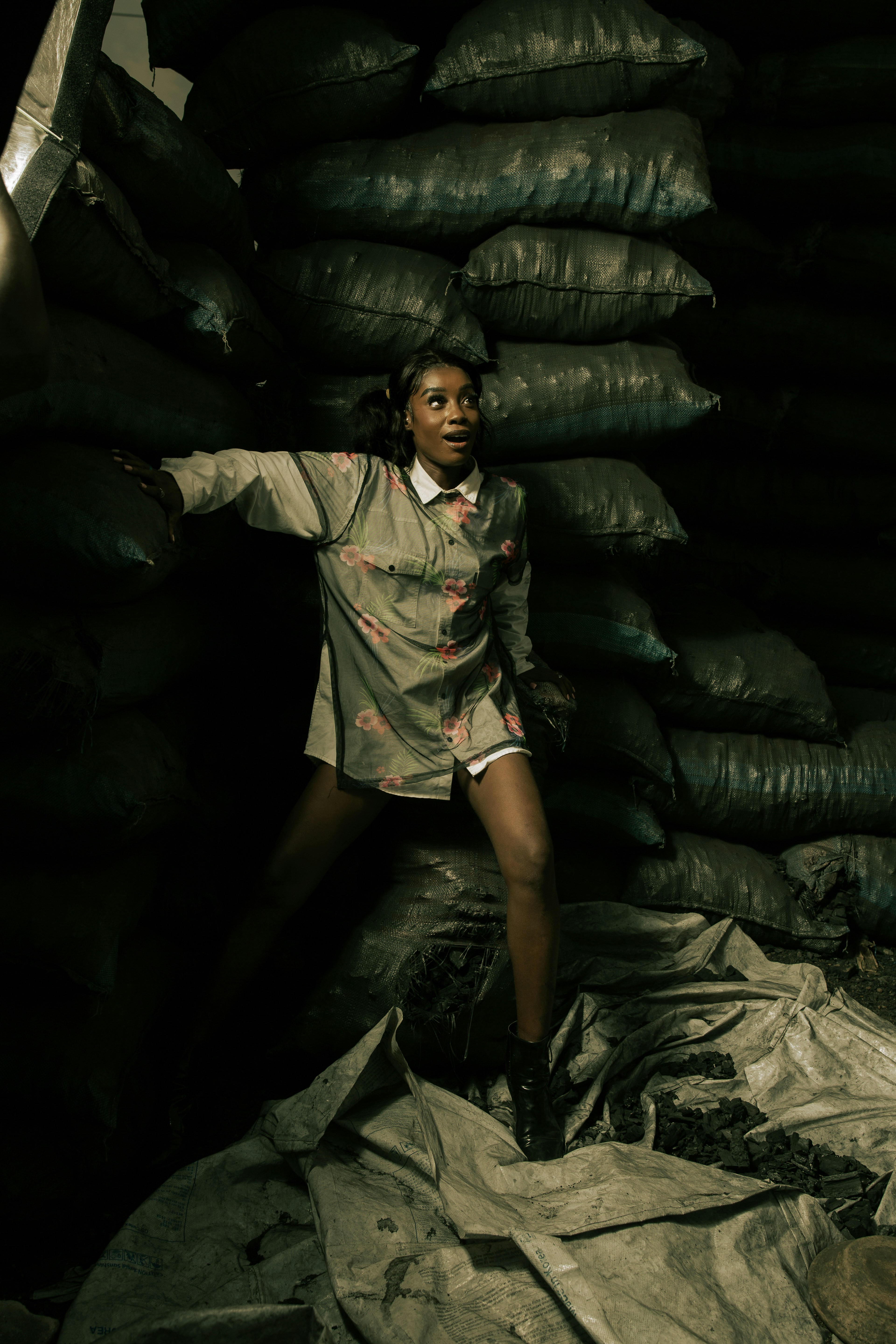 Emergence in the Stacks: A silhouette of resolve amid the bags