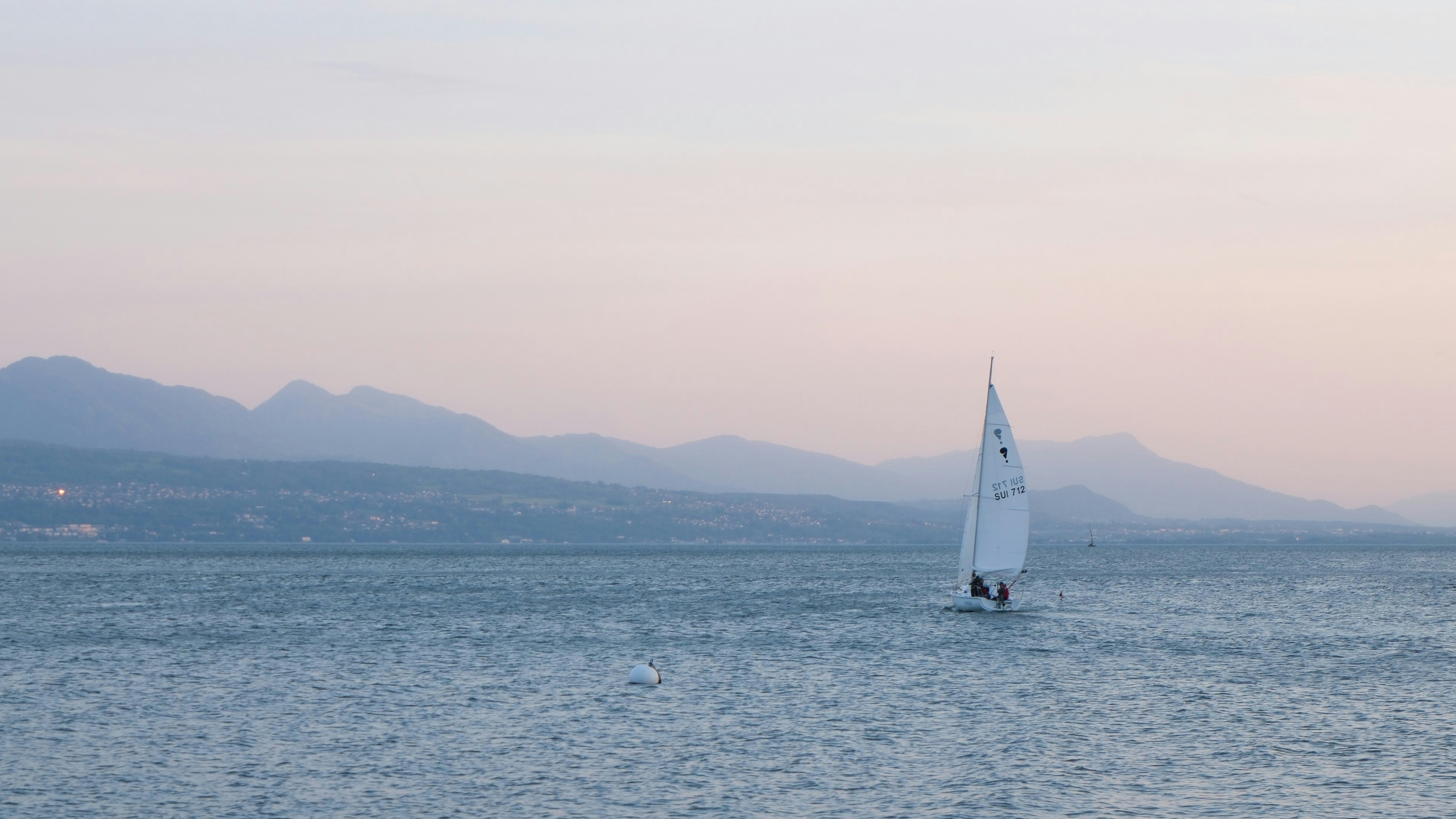 Sailboat Quietly Traversing a Lavender Horizon