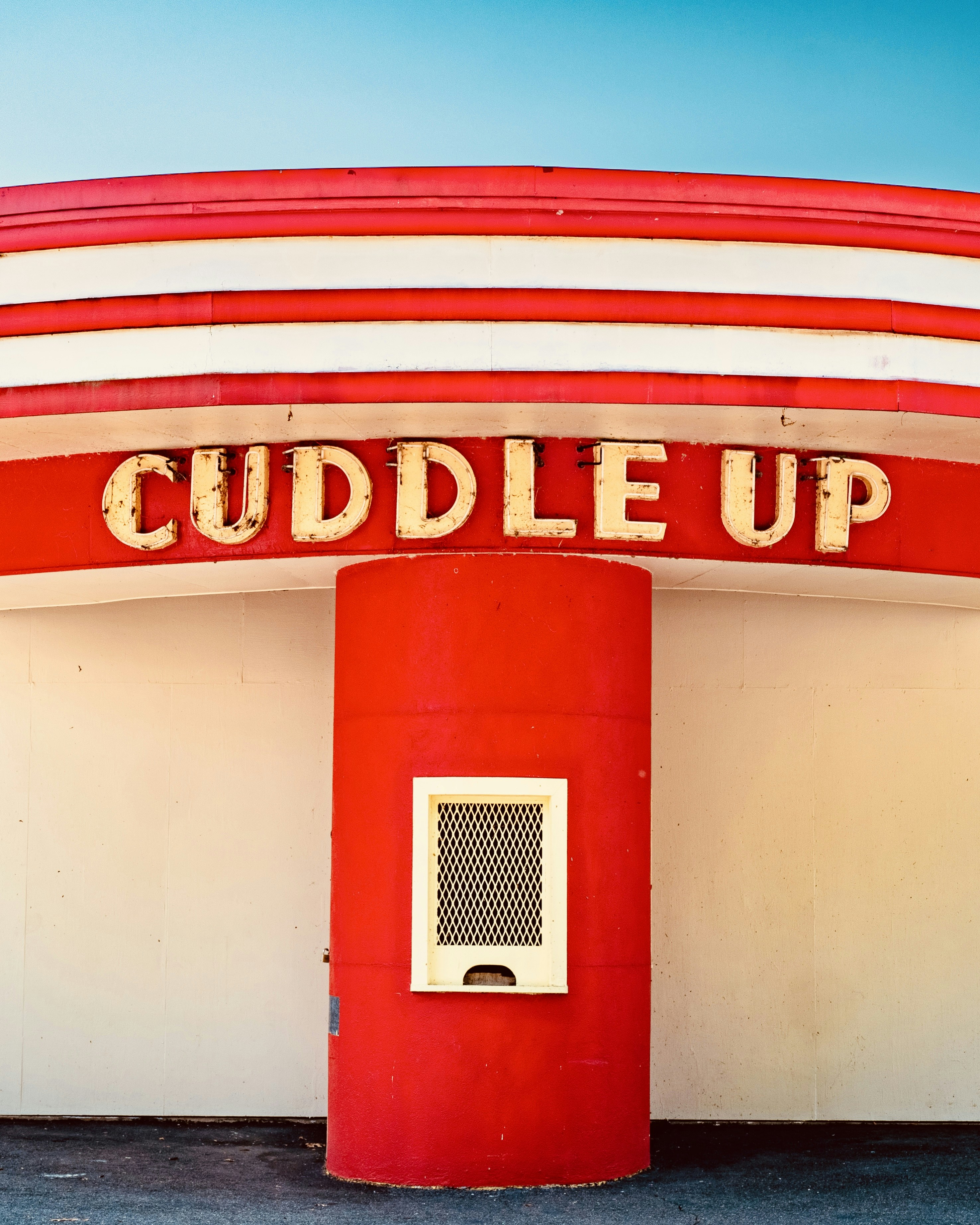 Cuddle Up at the Neon Red Facade
