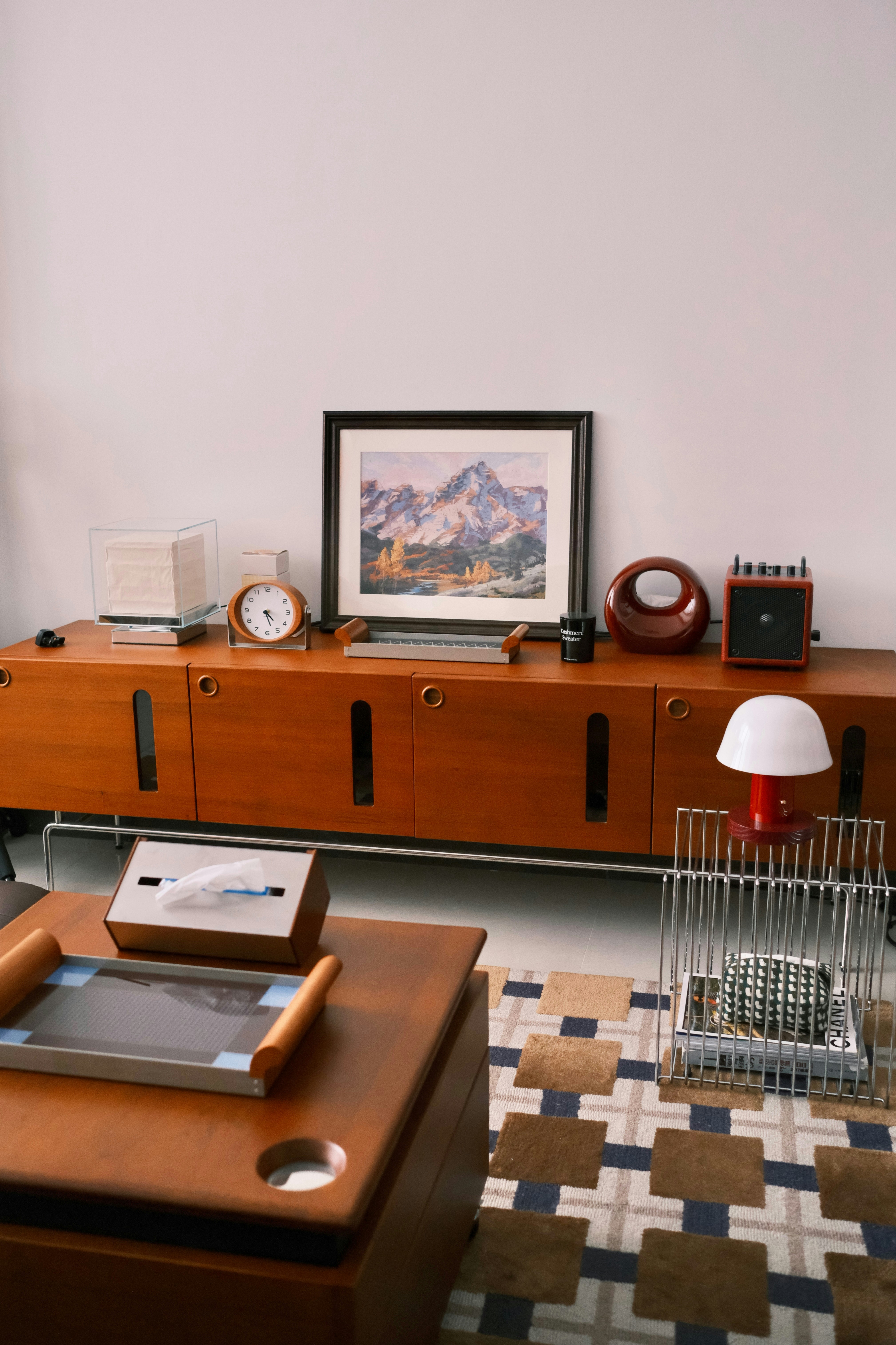 Mid-Century Still Life: A Row of Walnut Cabinets and Vintage Accents in Soft Light