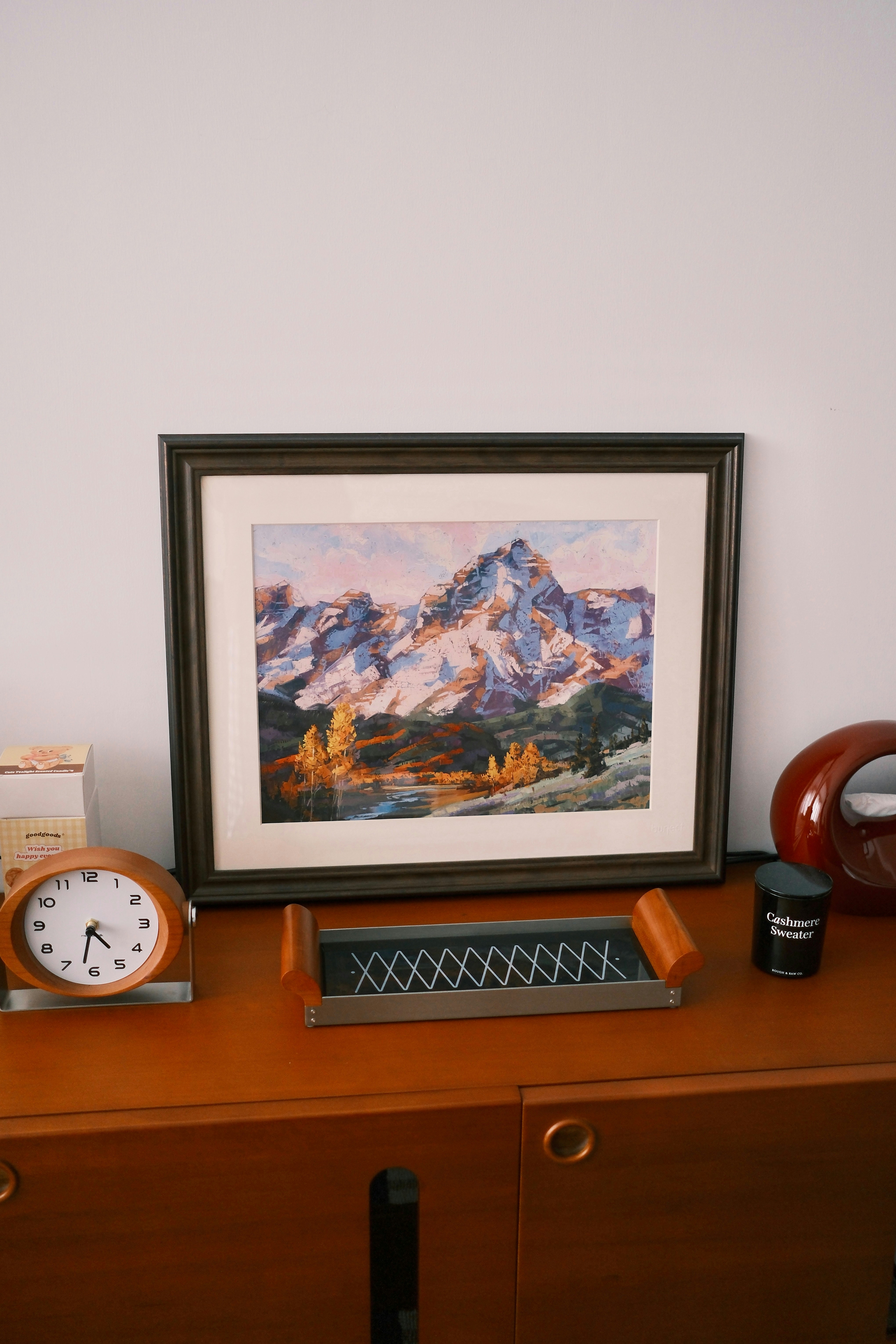 A Quiet Corner: Framed Mountain Echoes Over a Midcentury Mantel