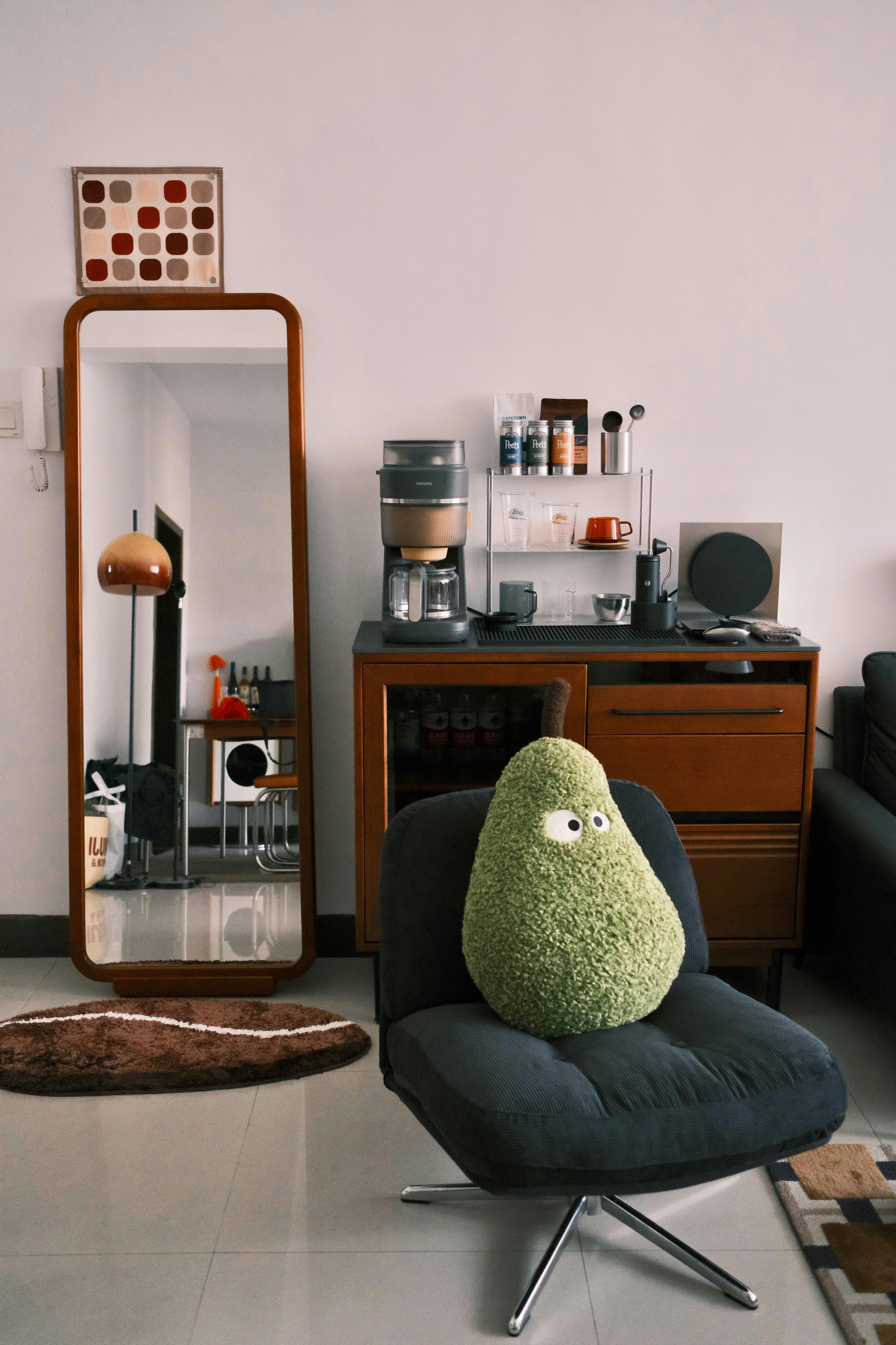 Mid-Century Nook: A Cozy Studio with a Plush Pear on Duty