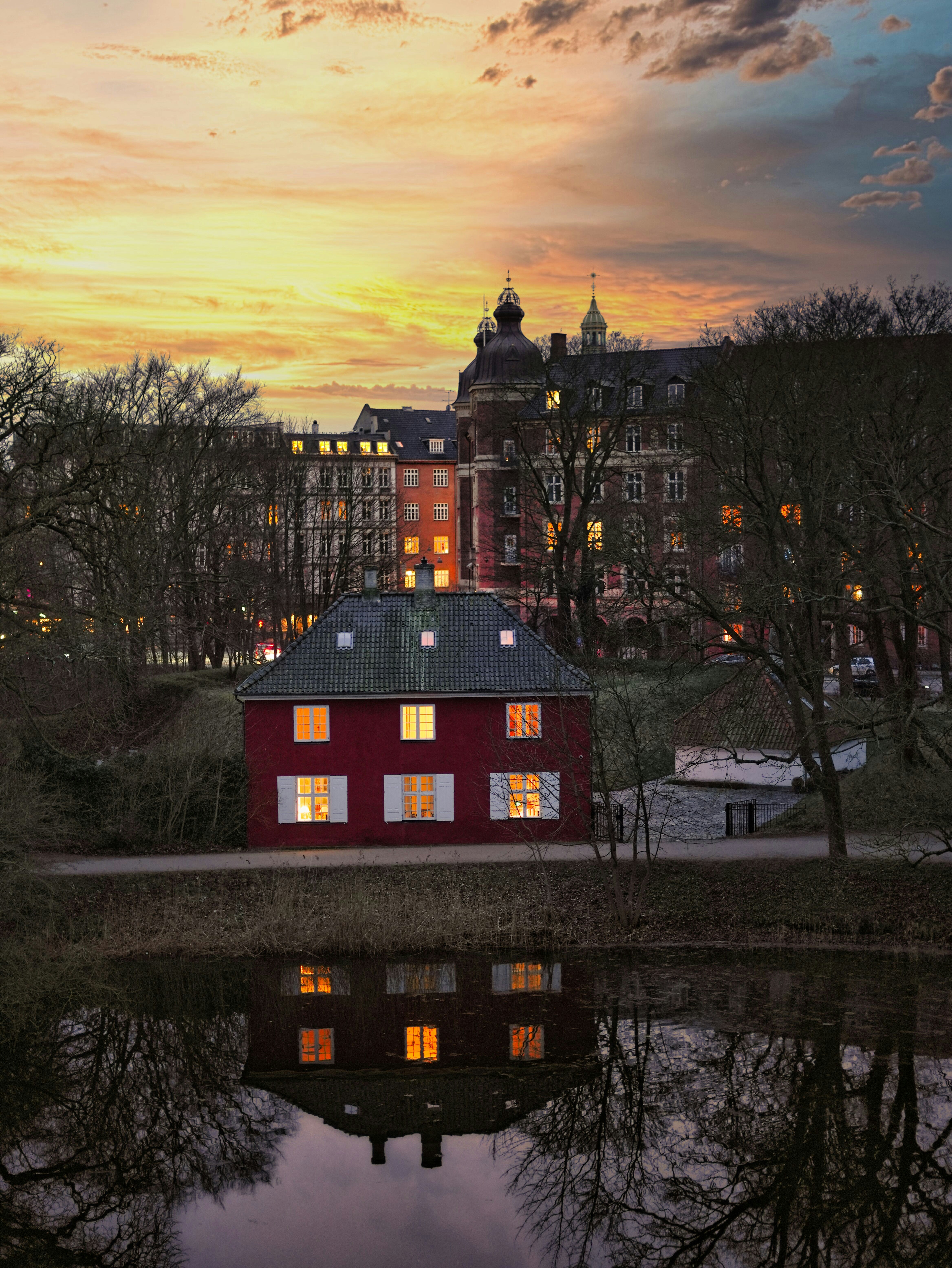Golden Hour Over the Red House by the River