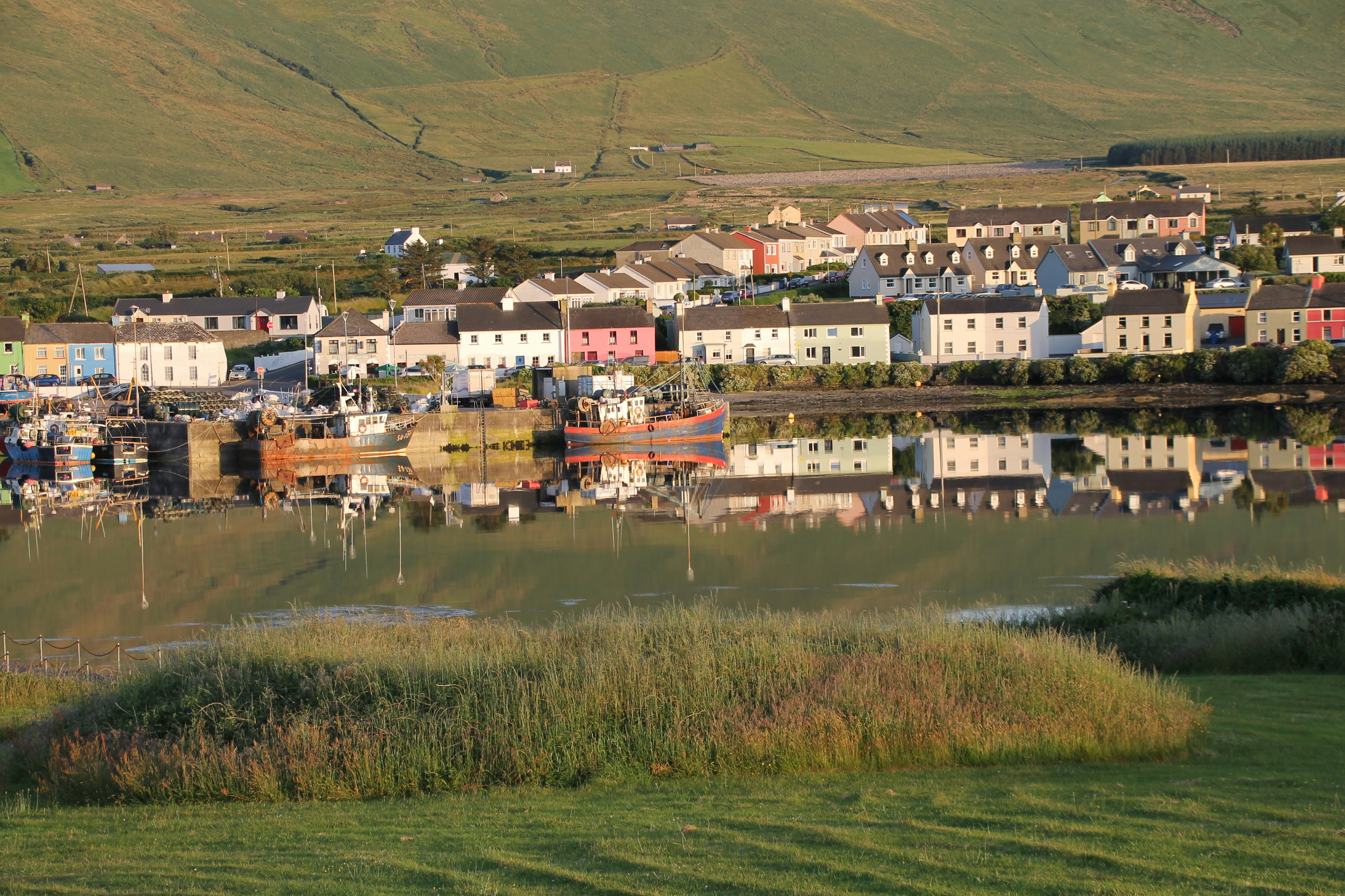Pastel Harbor Row: Colorful houses mirrored on calm water