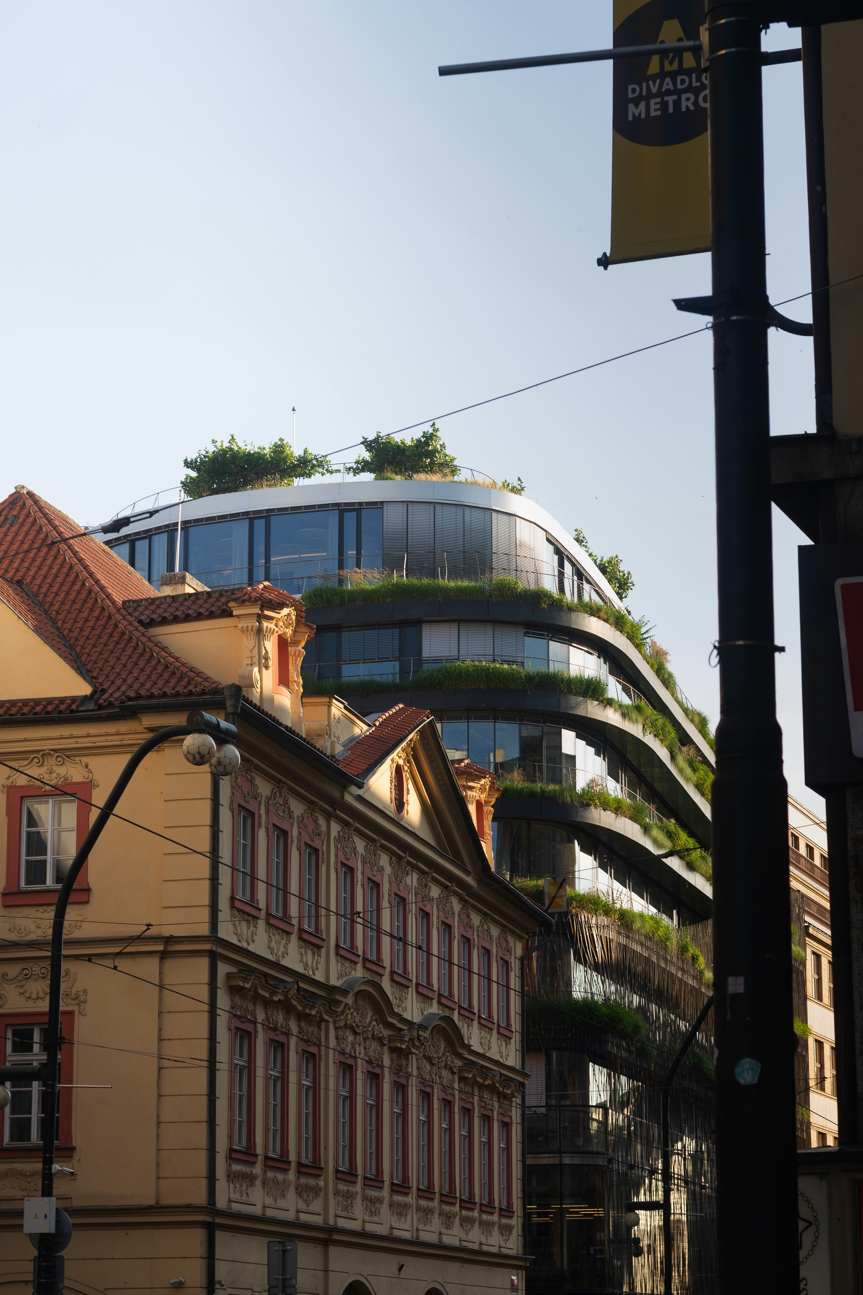 Urban Layers: A Curve of History and Glass