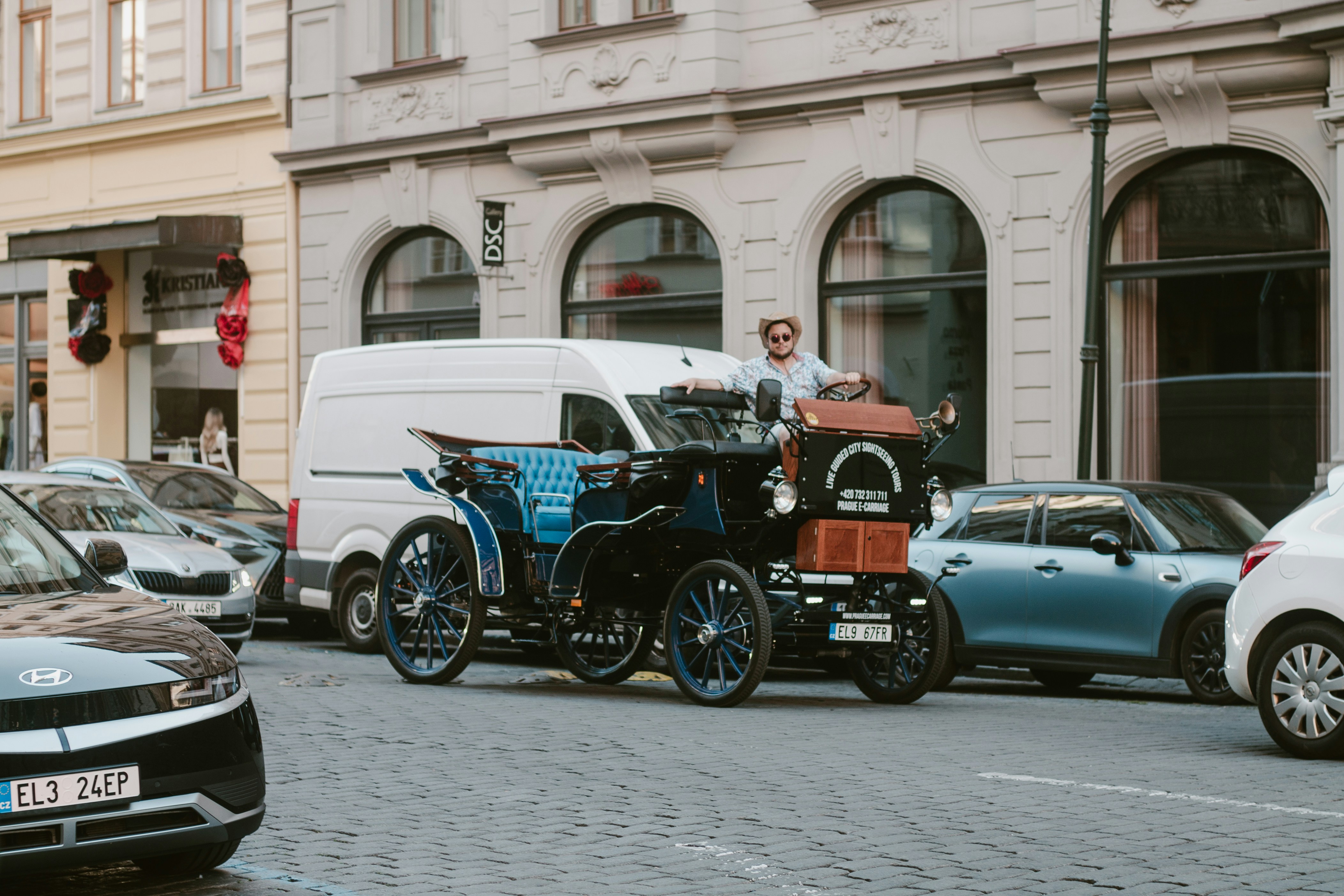 A gleaming vintage carriage pauses mid-city amidst modern traffic