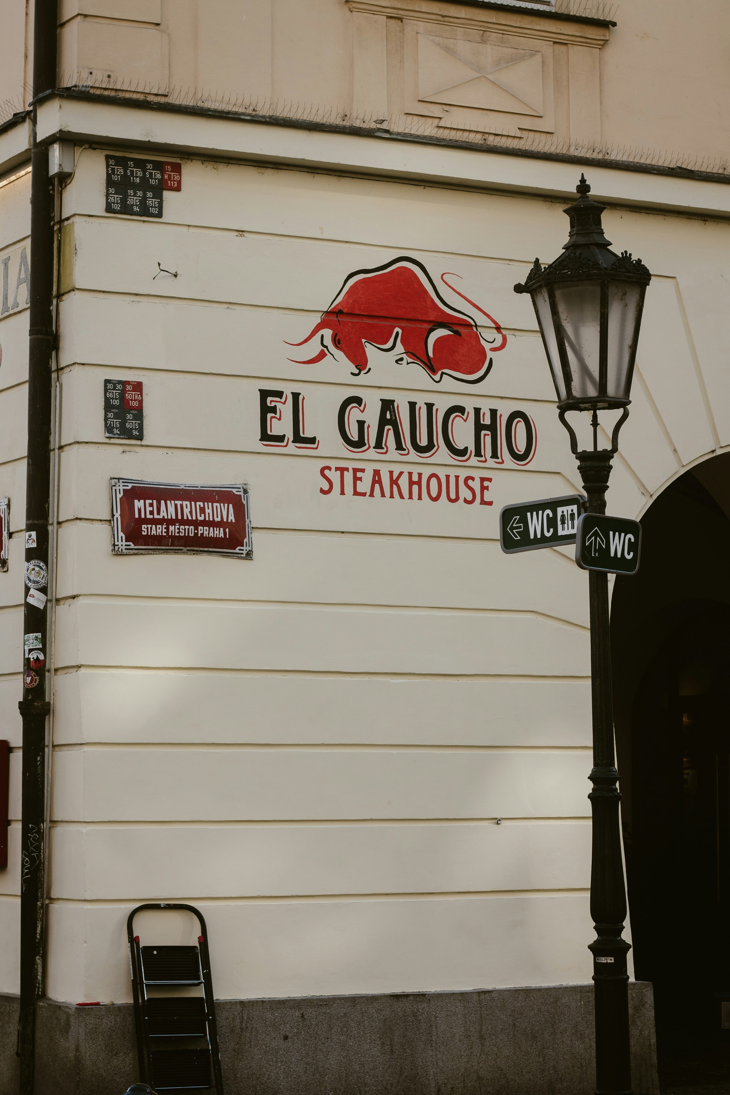 El Gaucho Neon: A Corner Steakhouse Sign Bathed in Old-World Streetlight