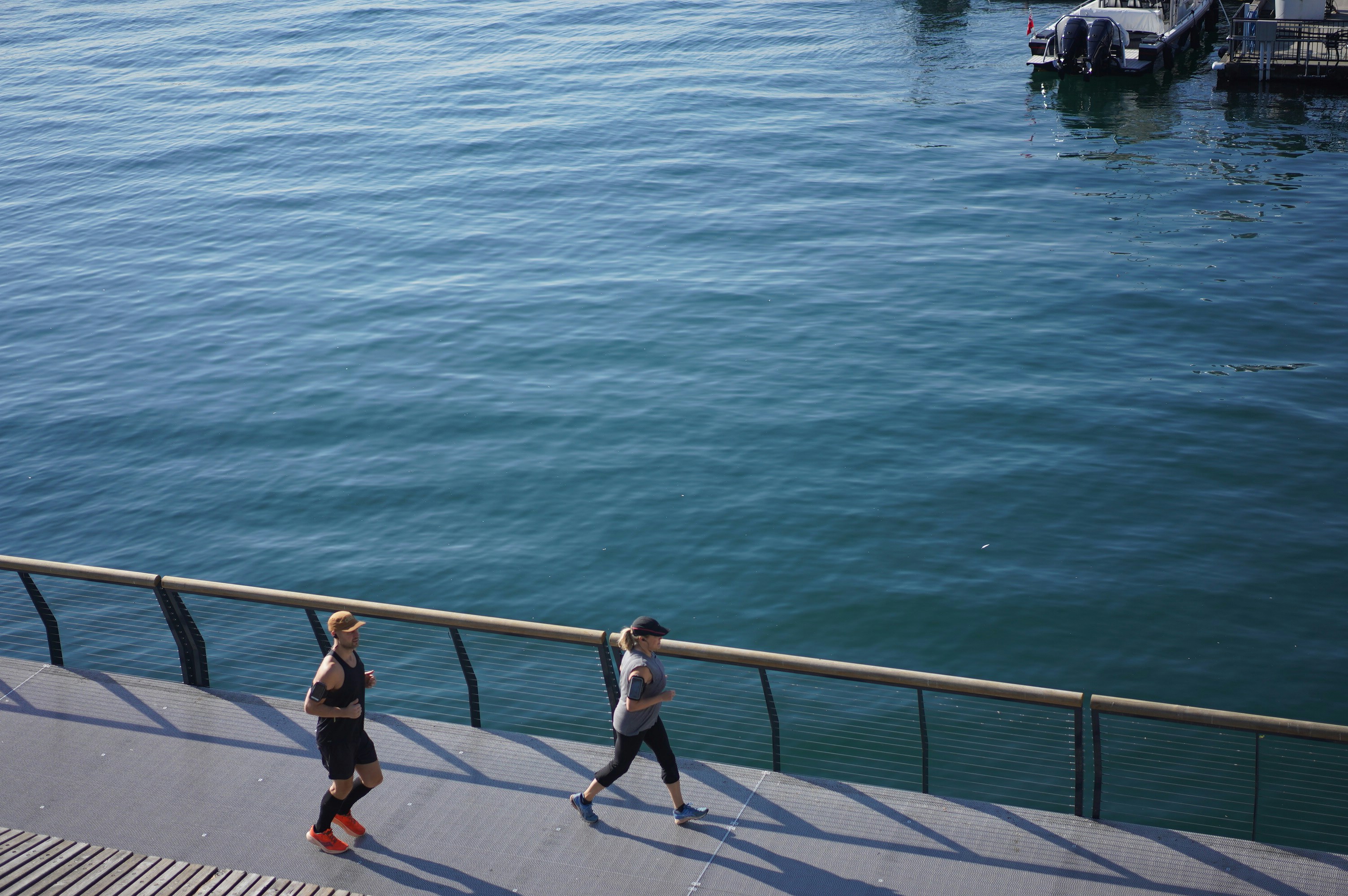 Runners Along the Seafront: A Quiet Moment on the Waterfront Promenade