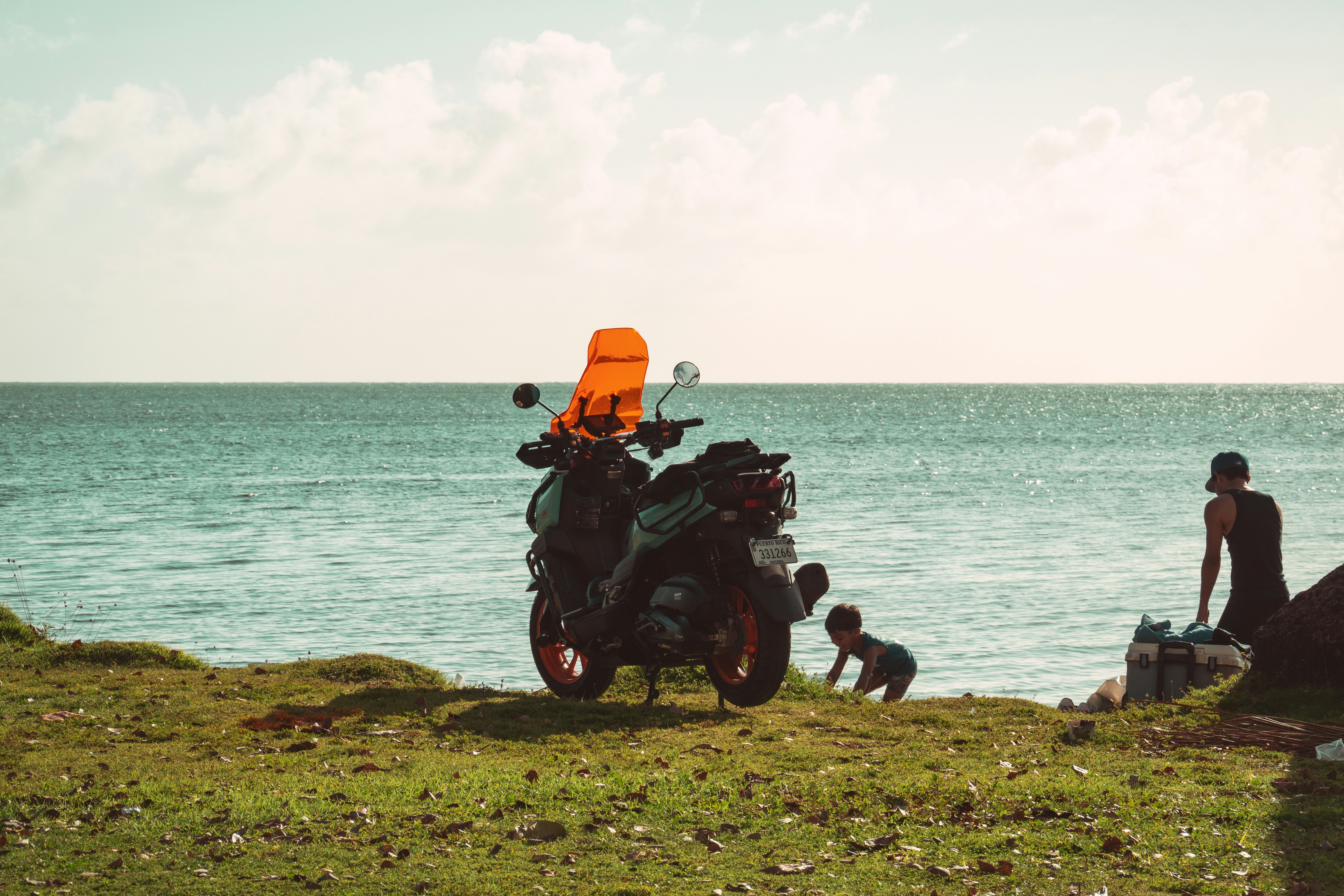 Solar-Orange Surf Gear Guarded by a Seaside Trio