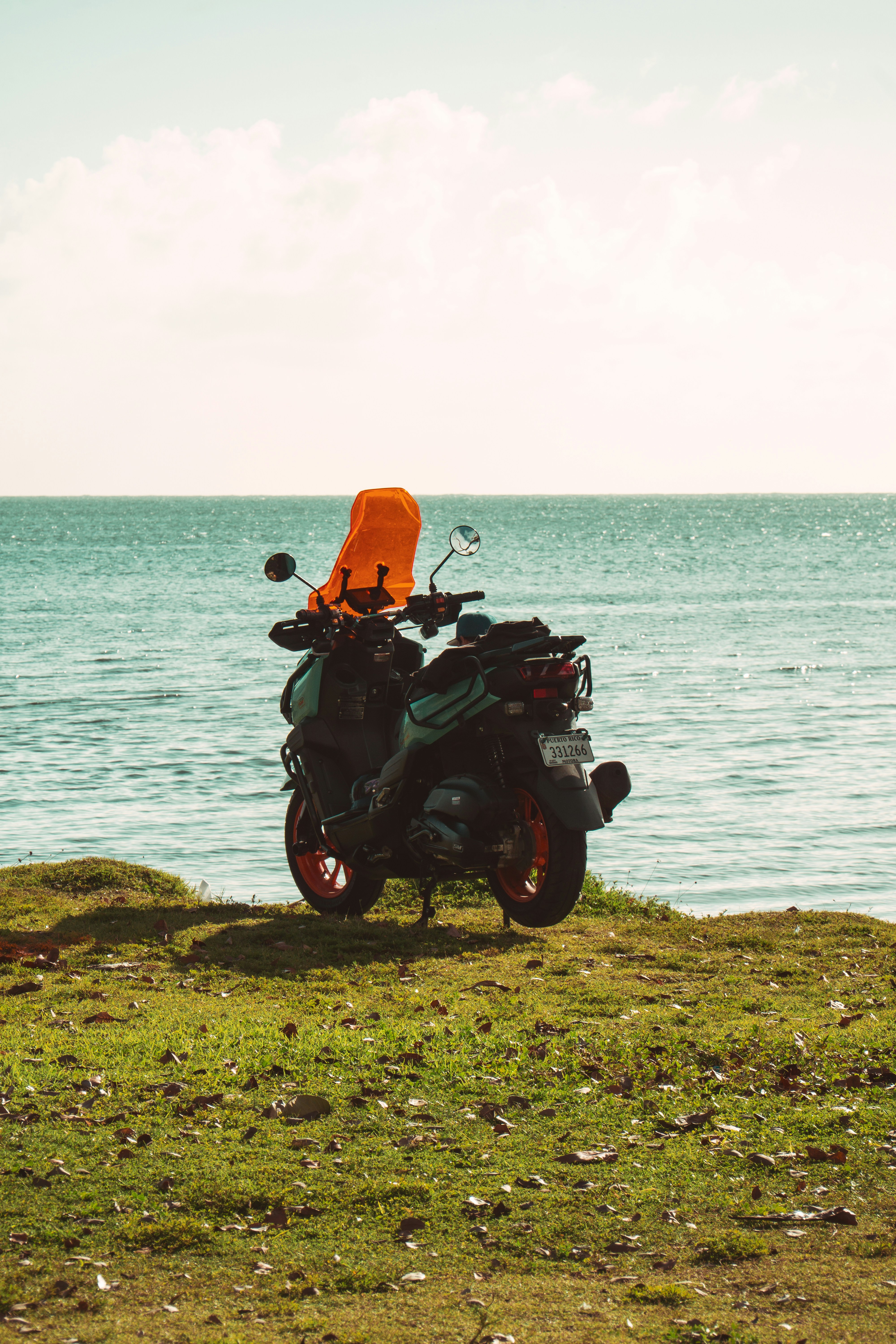 Orange-roofed Adventure: Motorcycle by the Sea