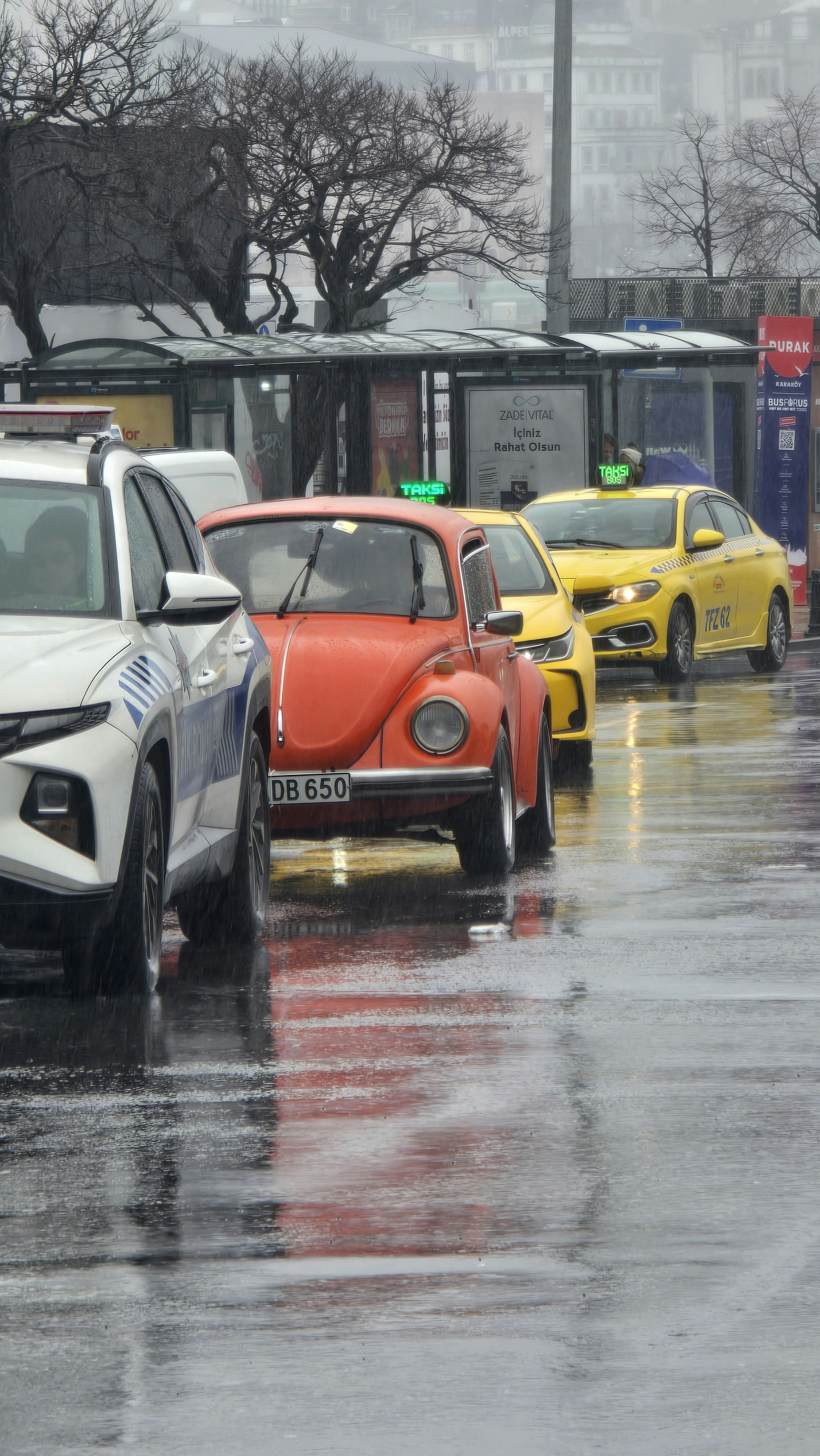 Line of Chromatic Rain: A City Taxi Parade in Wet Light