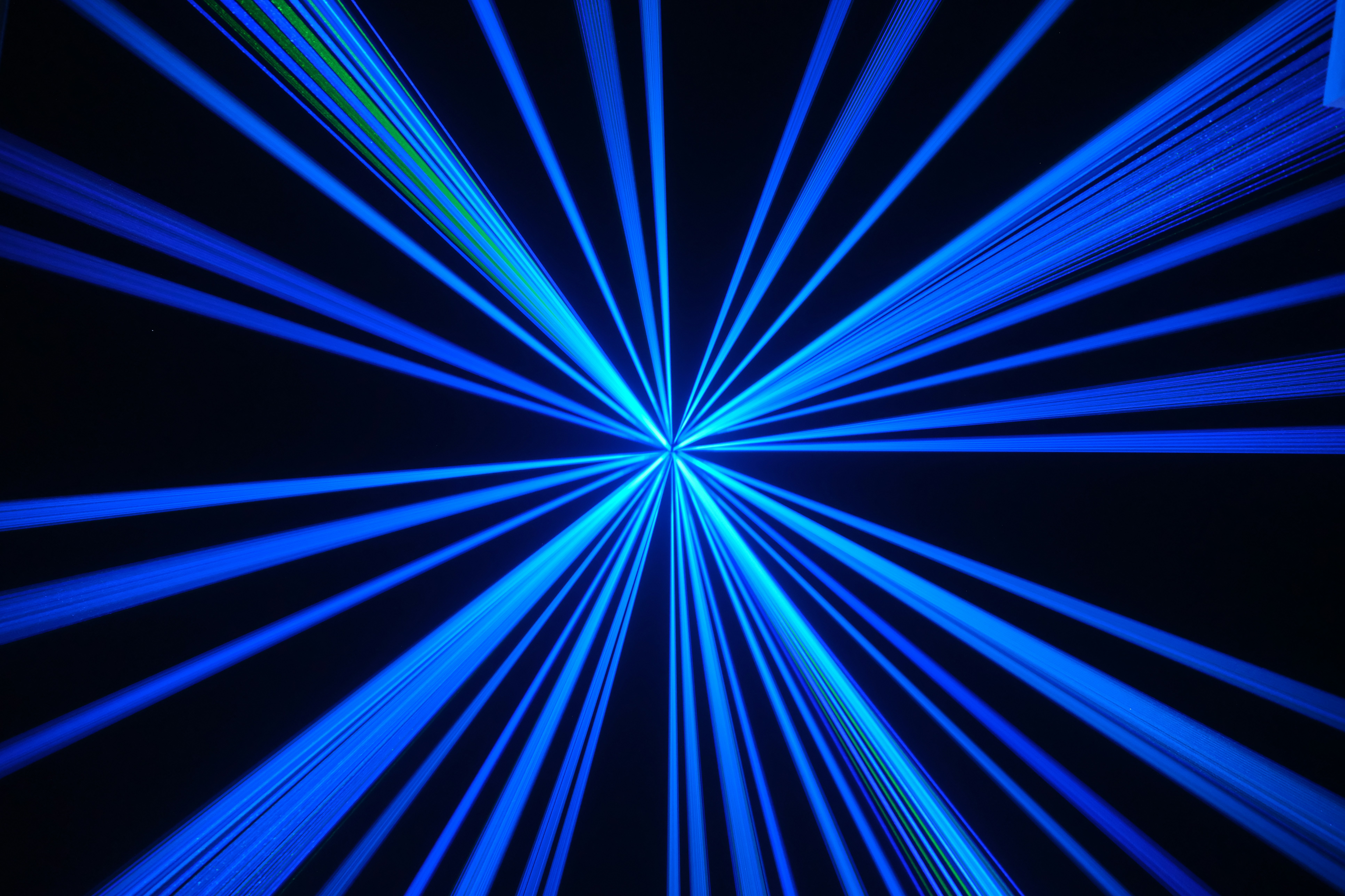 Pulse Convergence: Blue Laser Radiants Colliding at the Center
