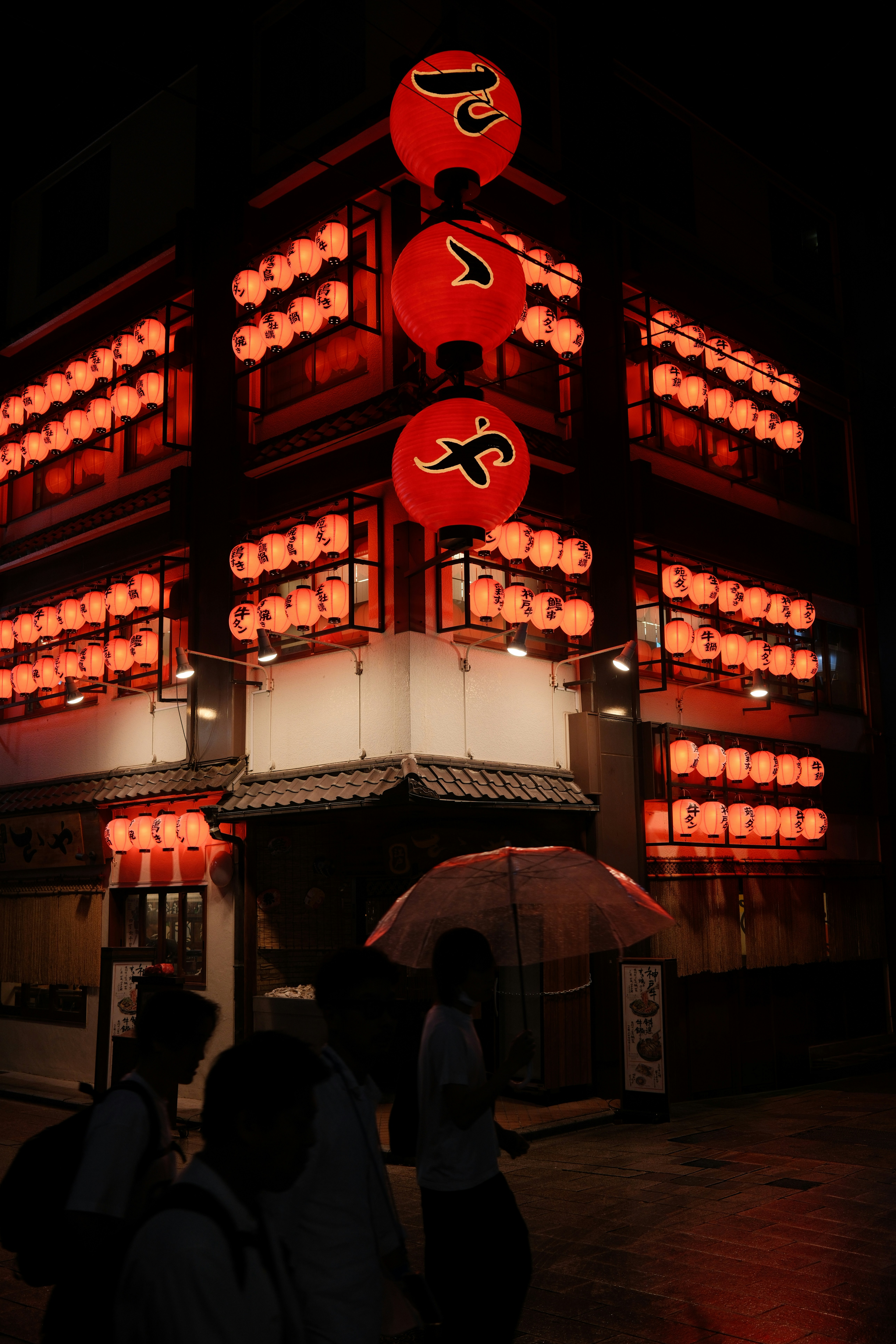 Lanterns in Shadow: Night in a Vibrant Street Corner