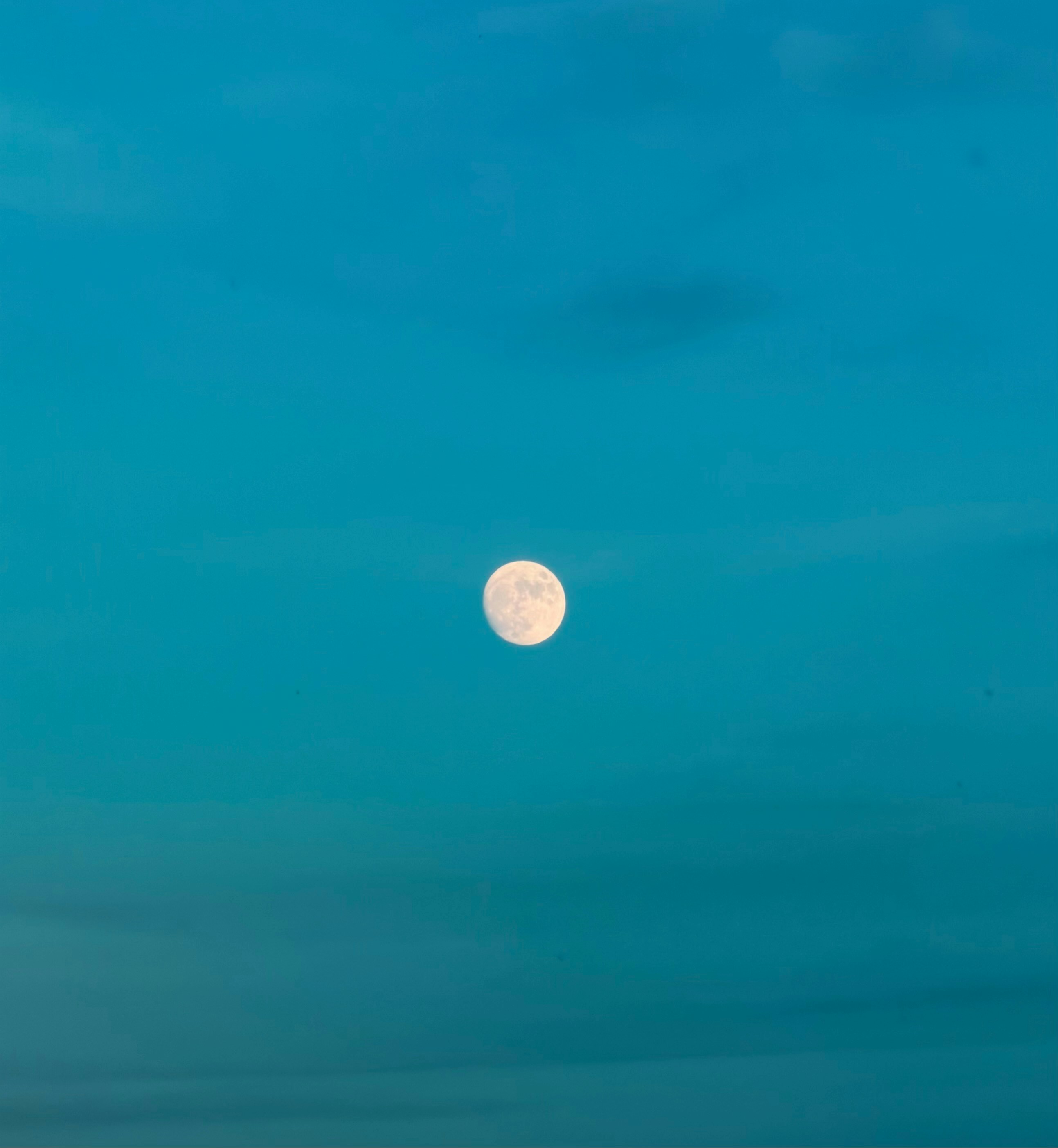 Silent Moon Above a Quiet Teal Sky