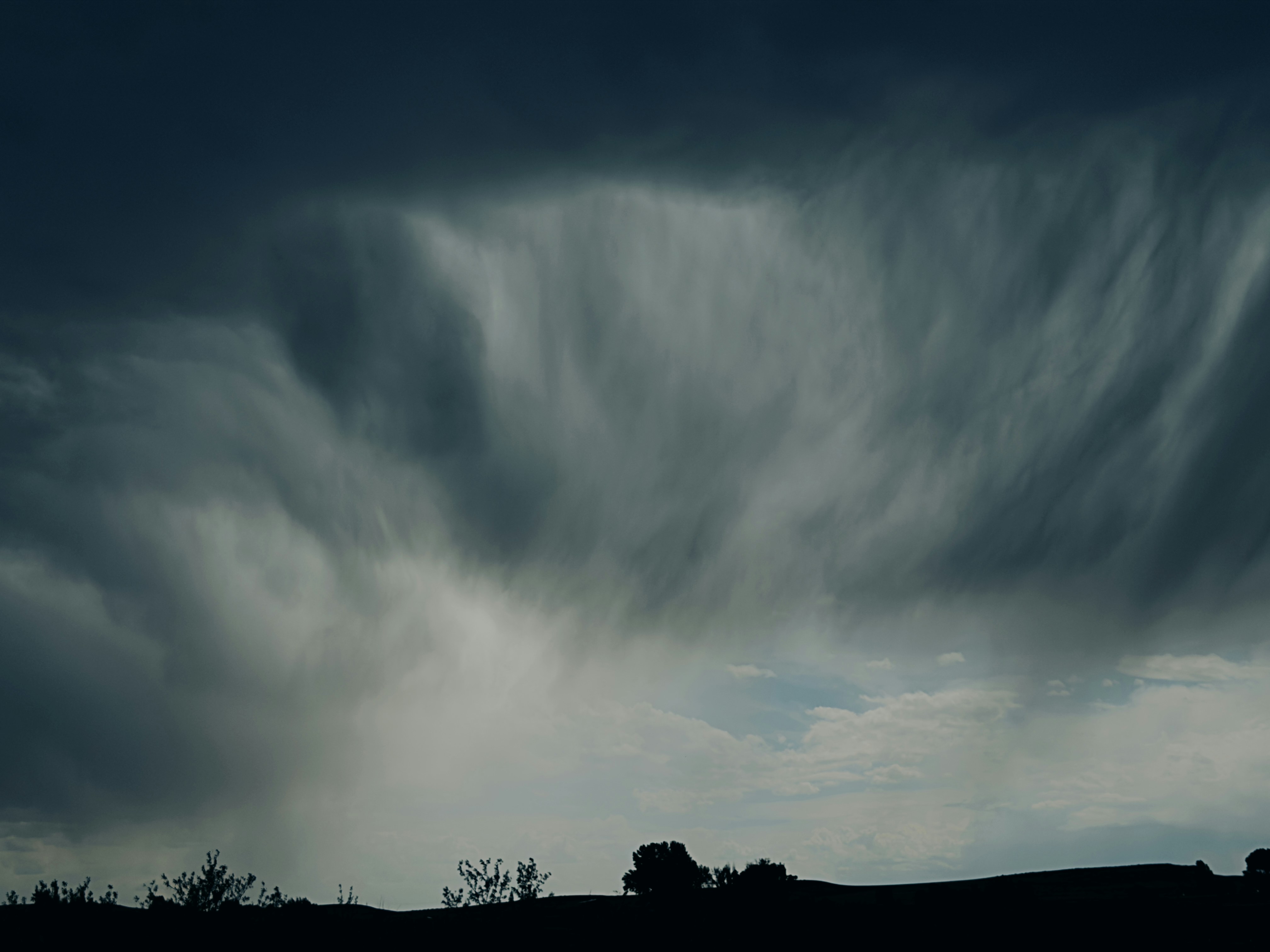 Dramatic Sky over a Quiet Horizon