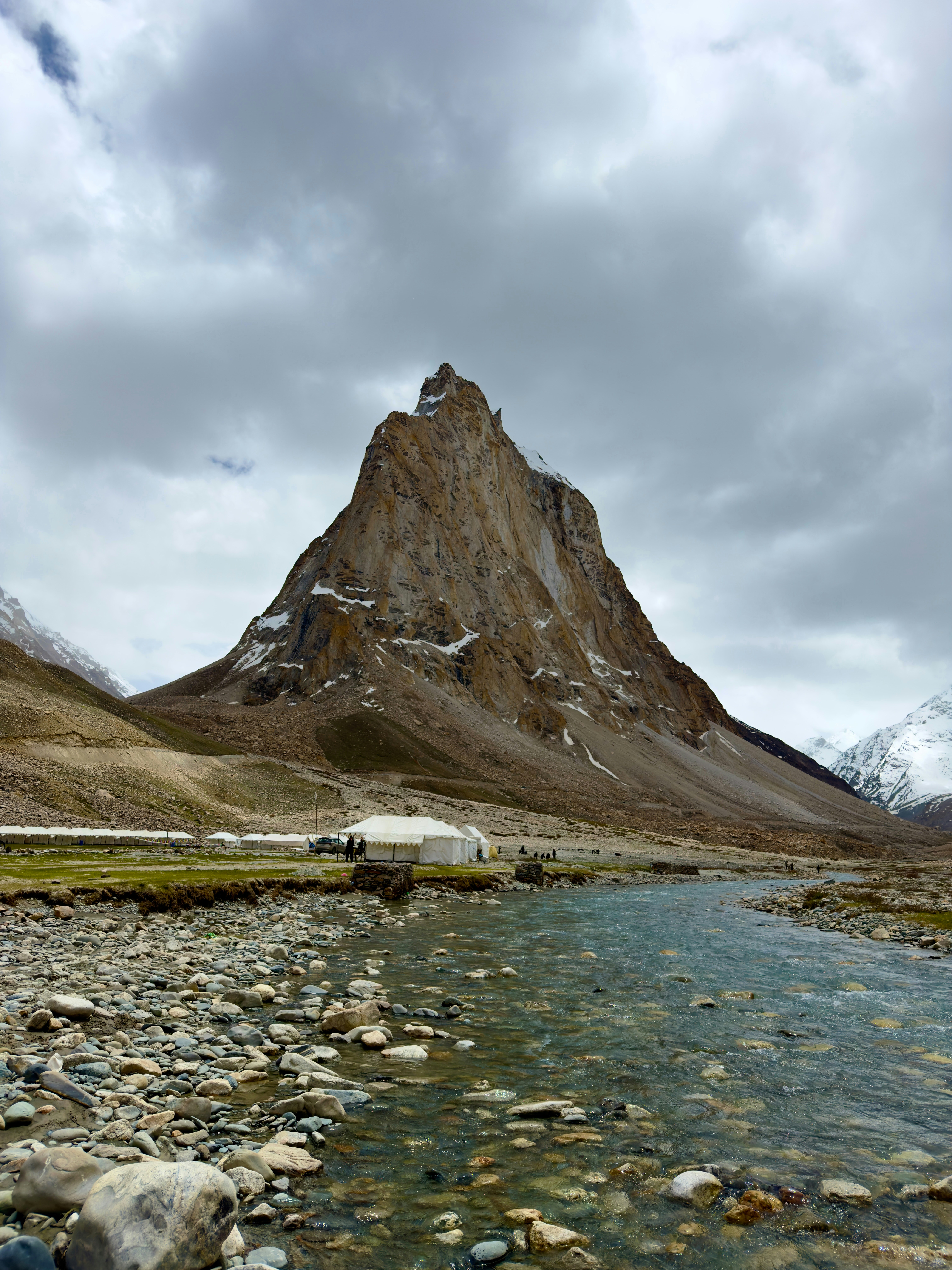 Towering Peak Over Glacier River Camp